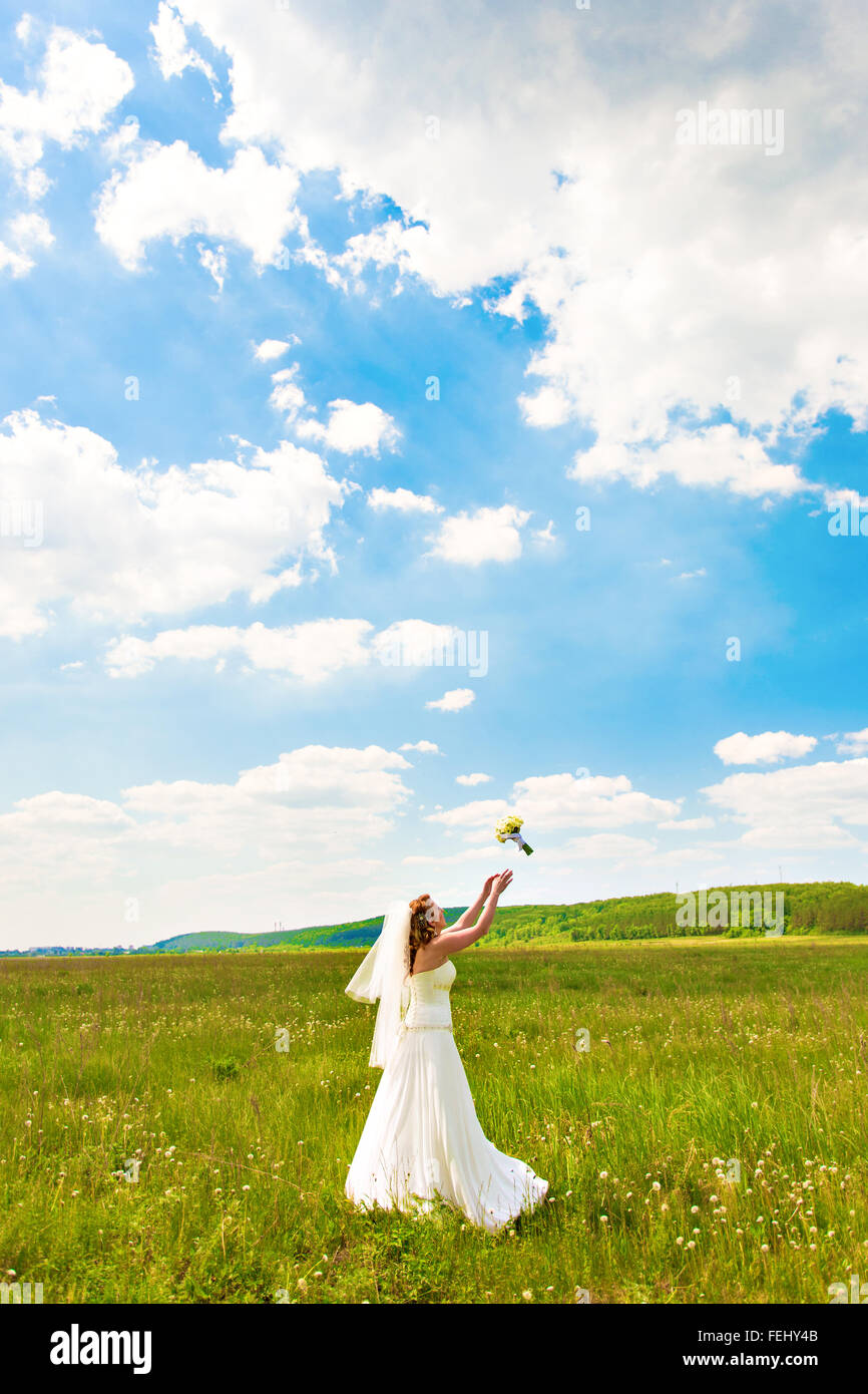 Woman catching wedding bouquet hi-res stock photography and images - Alamy
