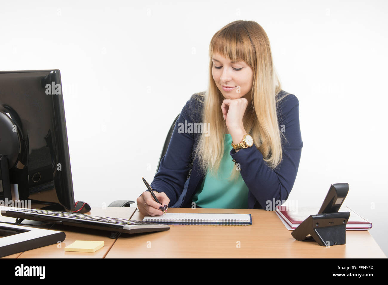 Attractive blonde secretary sitting desk hi-res stock photography and ...