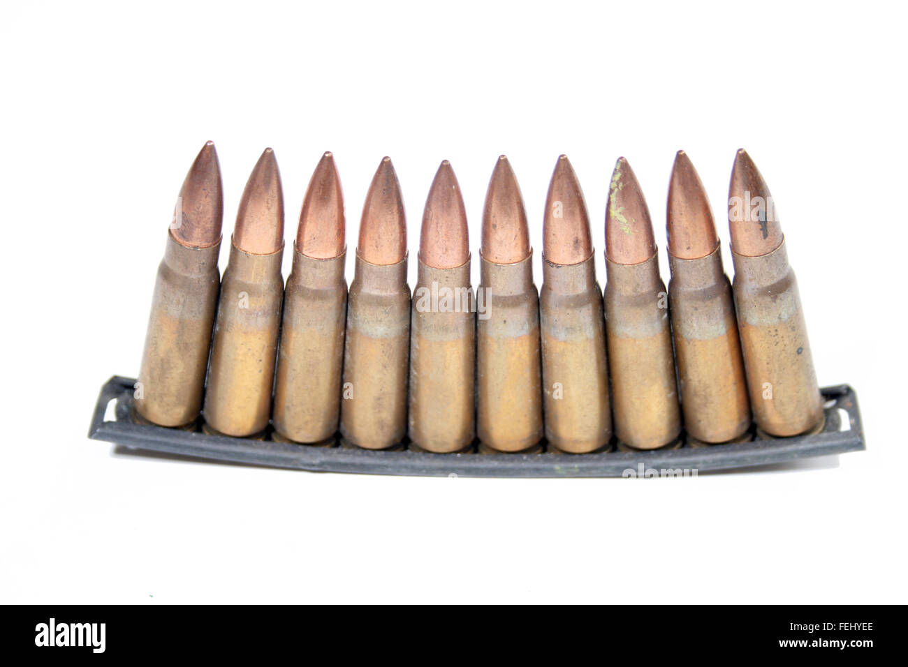 Bullets in cartridge on white background Stock Photo - Alamy