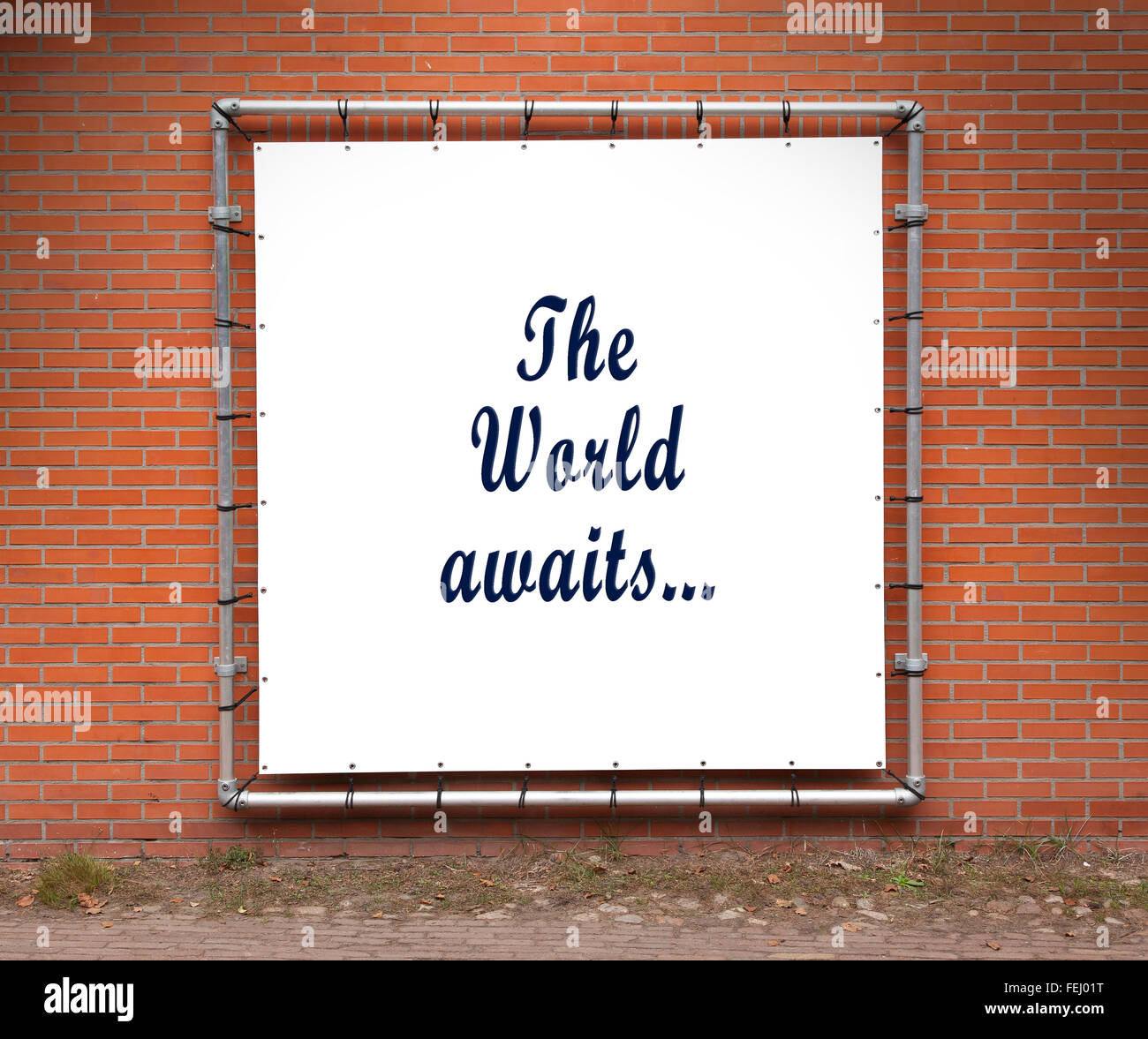 Large banner with inspirational quote on a brick wall - The world ...