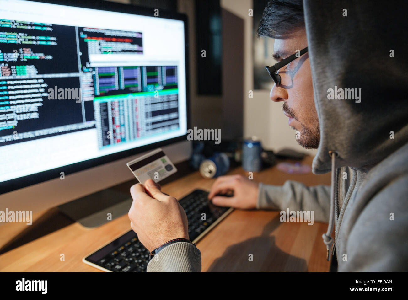 Hacker man credit cards hi-res stock photography and images - Alamy