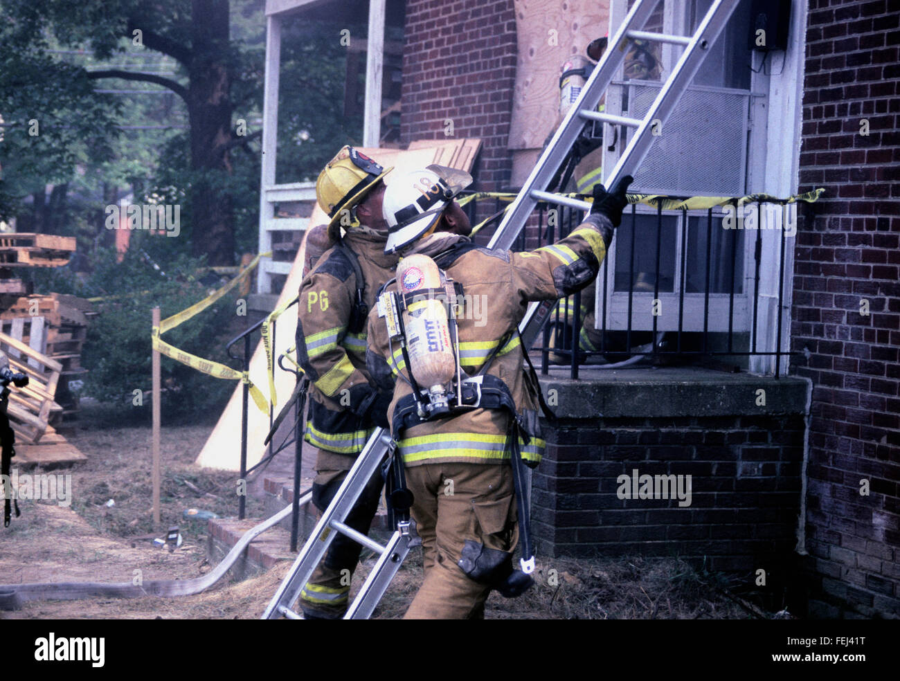 Firefighters with ladder hi-res stock photography and images - Alamy