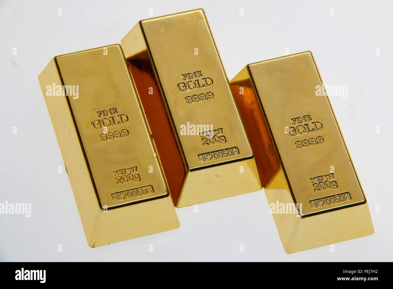 Three Gold Ingots Stock Photo - Alamy