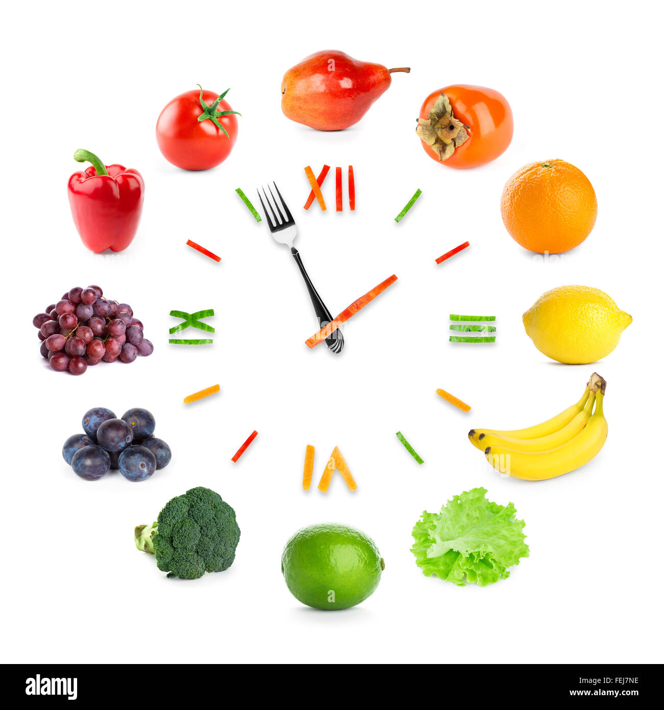Food clock with fruits and vegetables on white background. Food concept ...