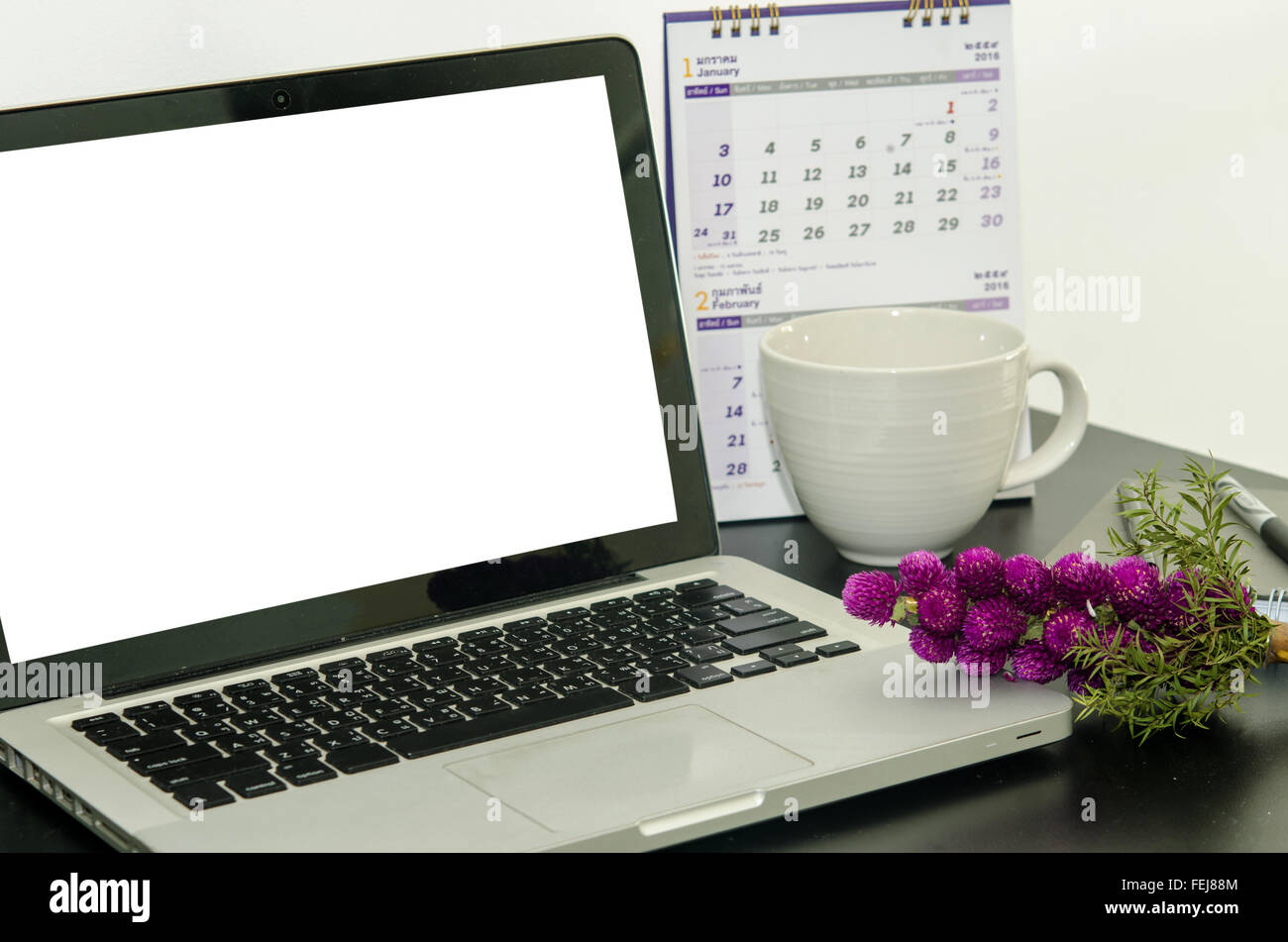 A note book, laptop,coffee cup, pen, on the office desk Stock Photo - Alamy