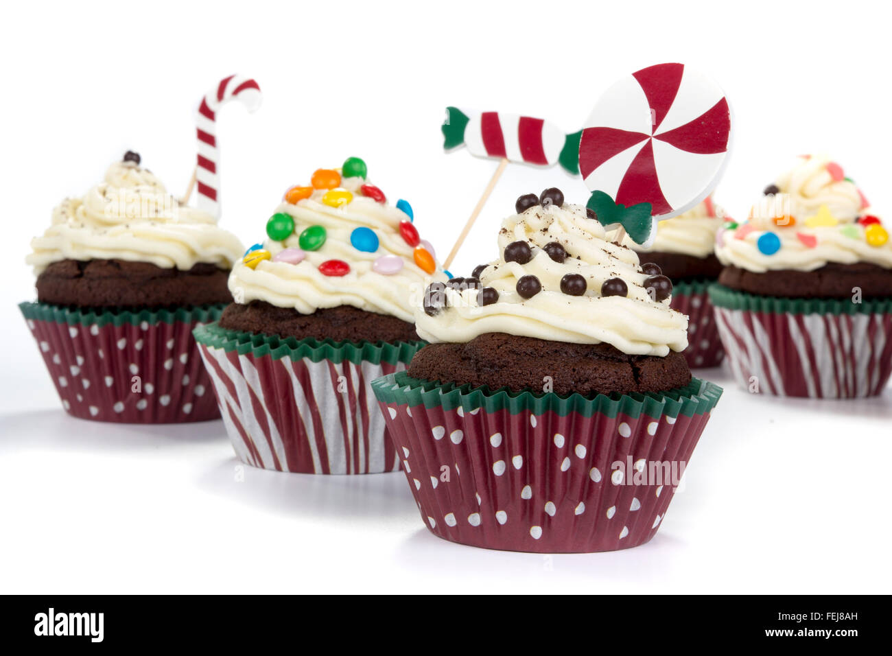 delicious party muffins with cream isolated on white background Stock ...