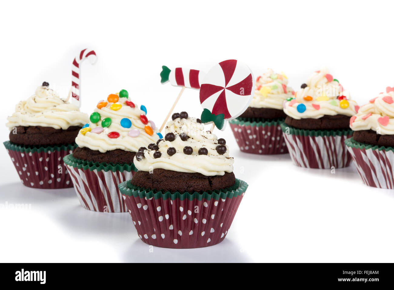 delicious party muffins with cream isolated on white background Stock ...