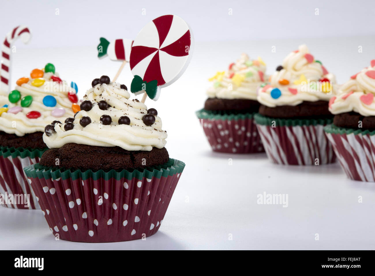 chocolate party muffins with cream isolated on white background Stock ...
