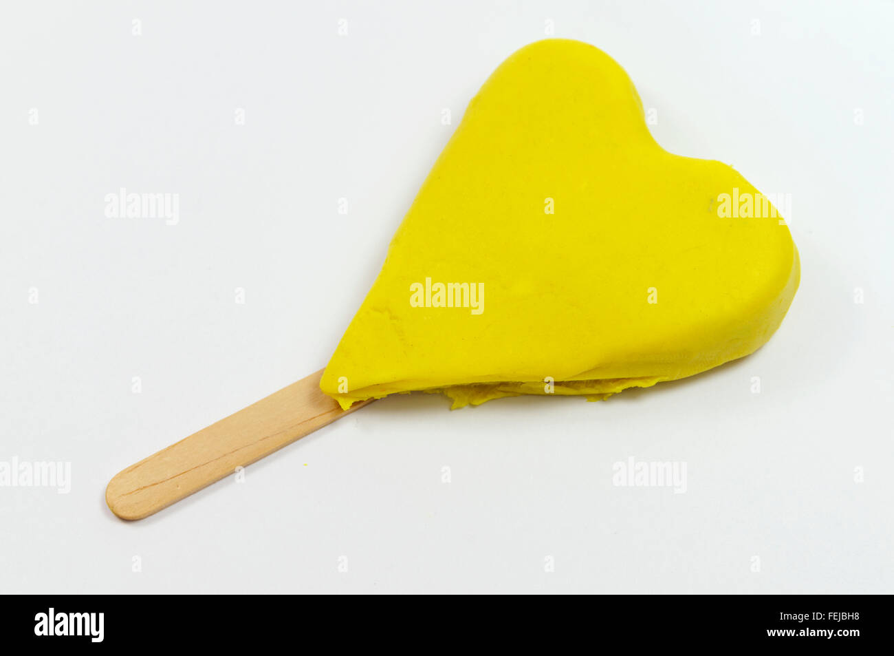 Yellow heart shaped Ice lolly made from Play-doh Stock Photo - Alamy