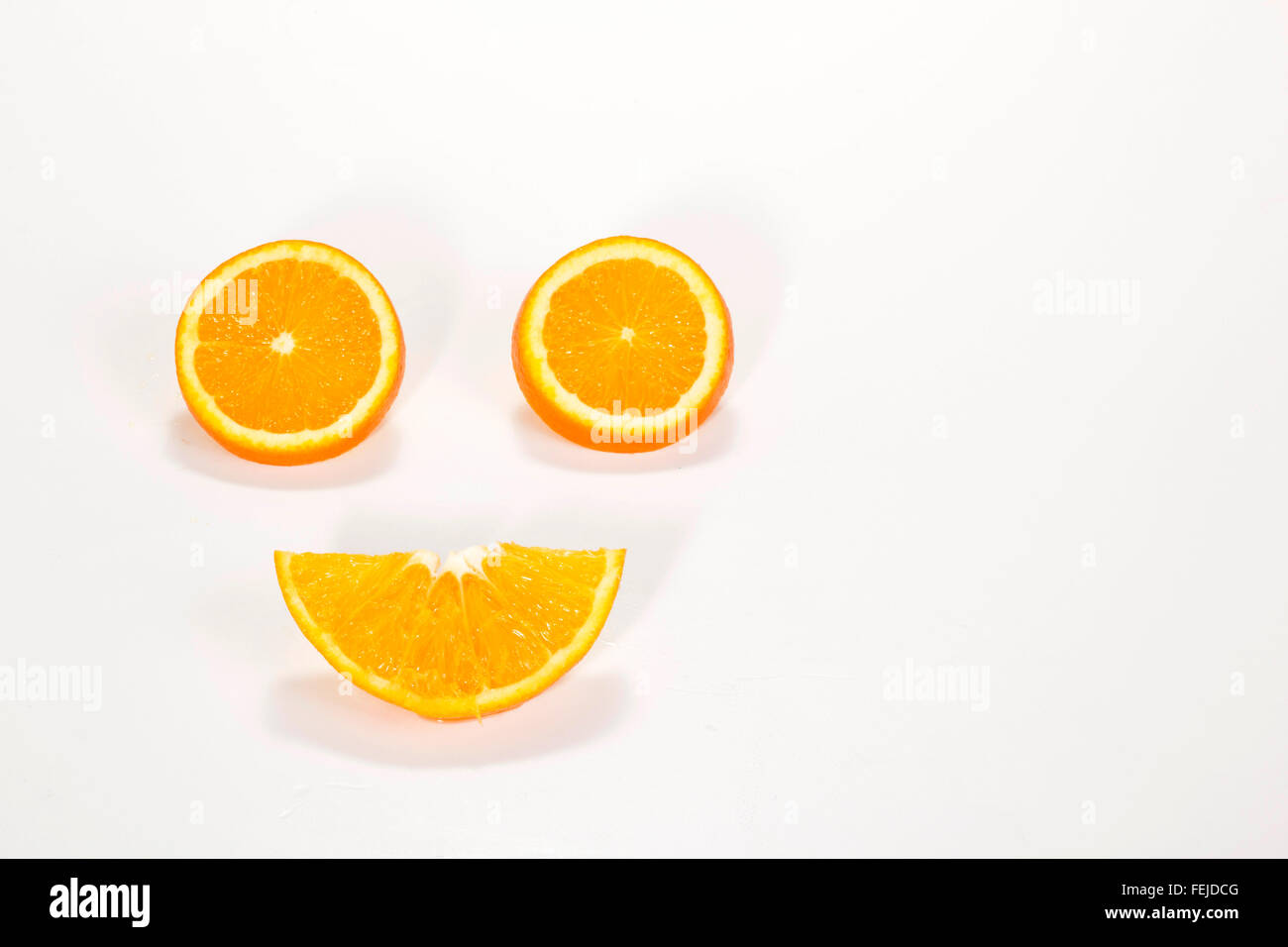 face from oranges isolated on white background Stock Photo - Alamy