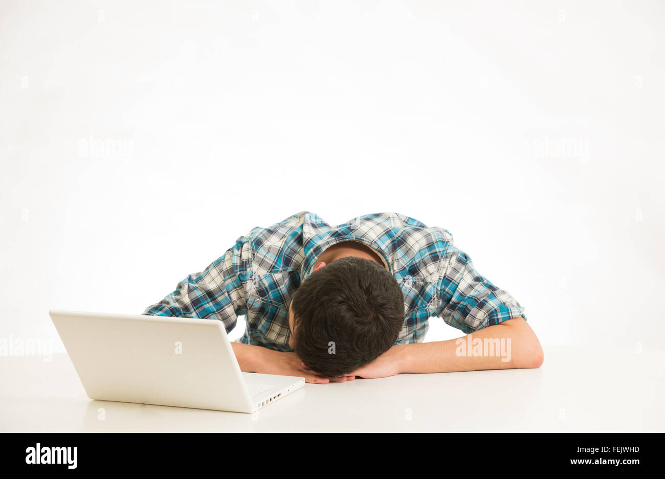 Tired white man working laptop hi-res stock photography and images - Alamy