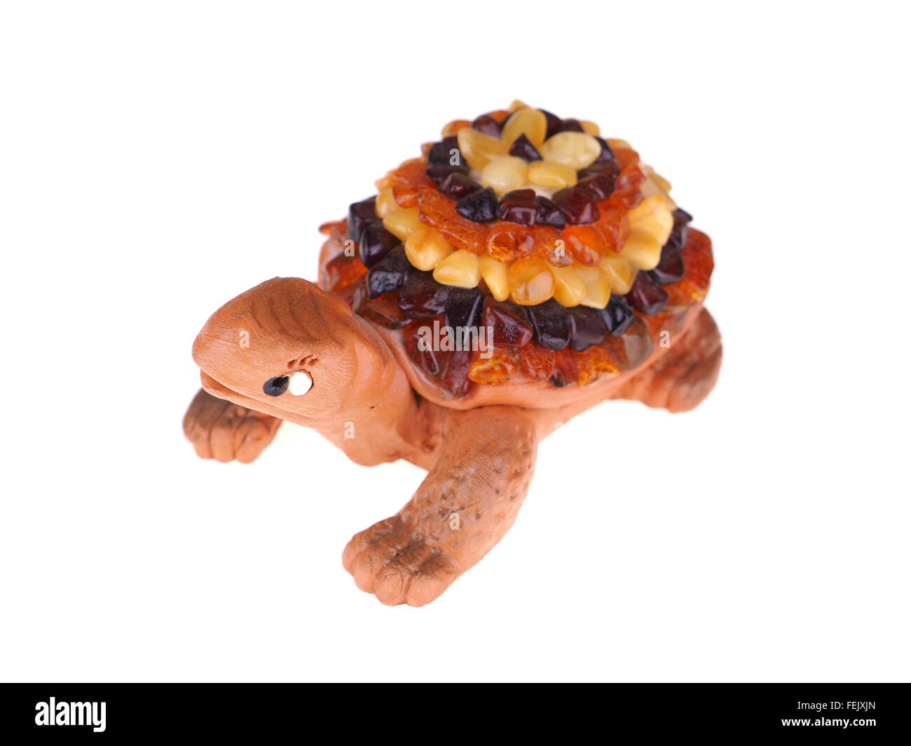 toy turtle with a shell made of amber on a white background Stock Photo ...
