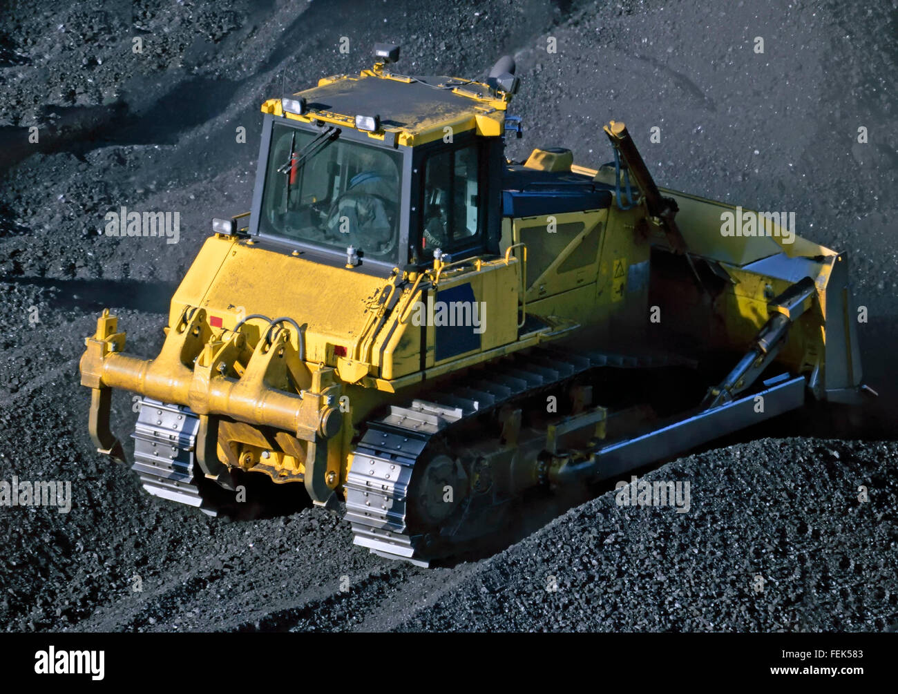 The super powerful bulldozer, tractor rows of coal Stock Photo - Alamy