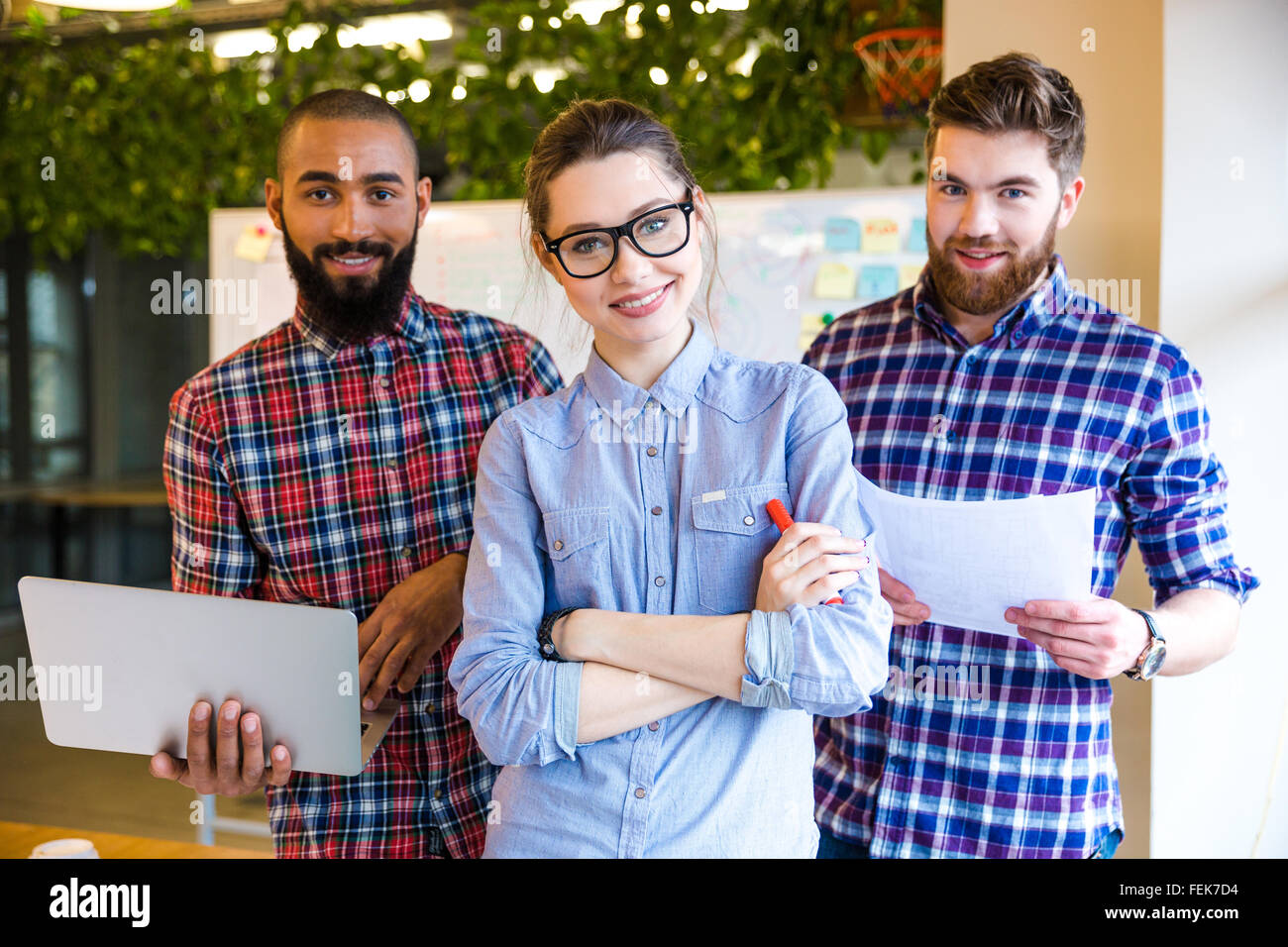 Group co workers standing in office hi-res stock photography and images ...