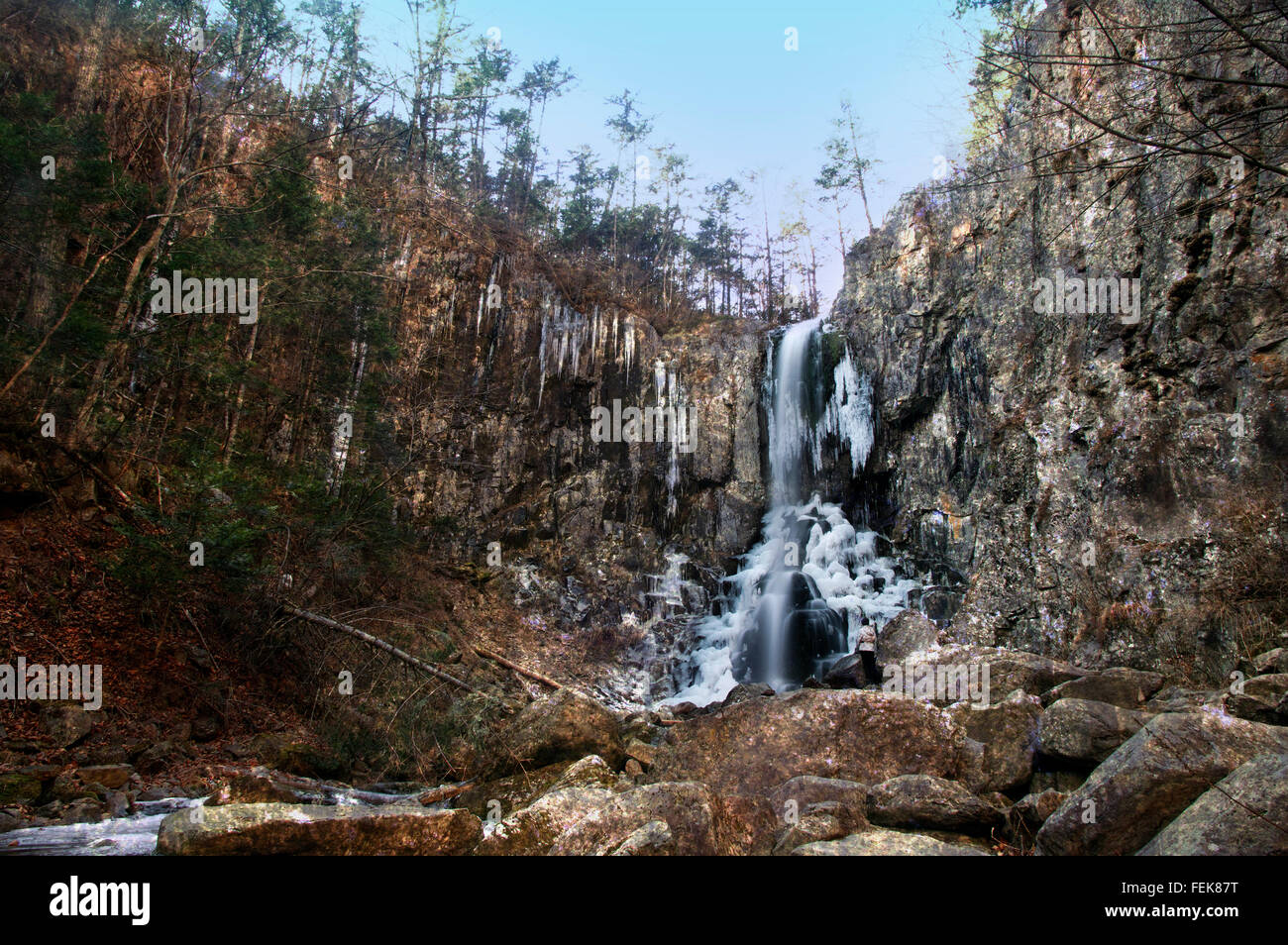 High waterfall falling from a cliff in the autumn Stock Photo - Alamy