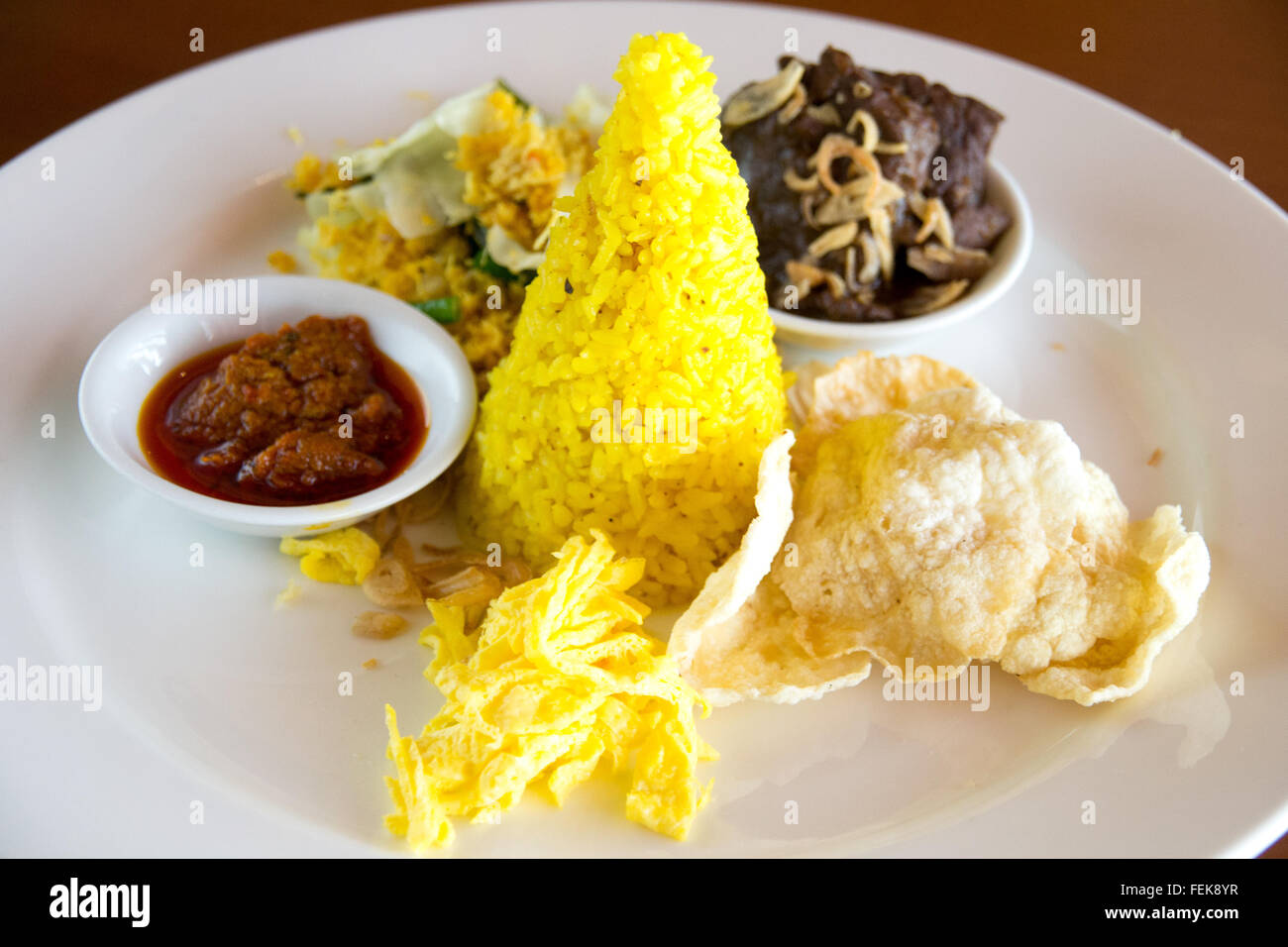 Nasi Kuning Indonesian yellow rice served with braised beef, shredded ...