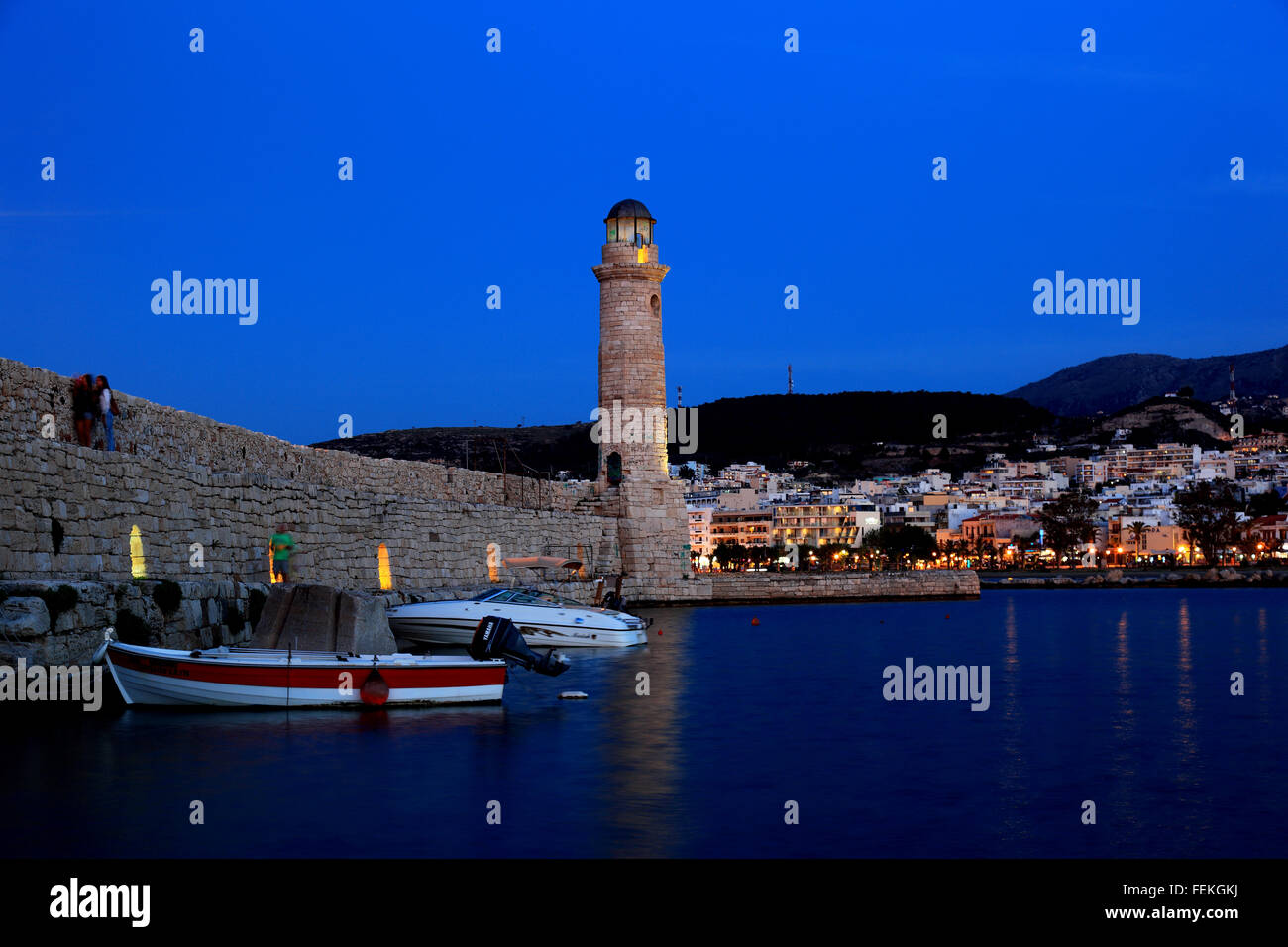 Crete, port Rethymno, old lighthouse at night in the Venetian harbour ...