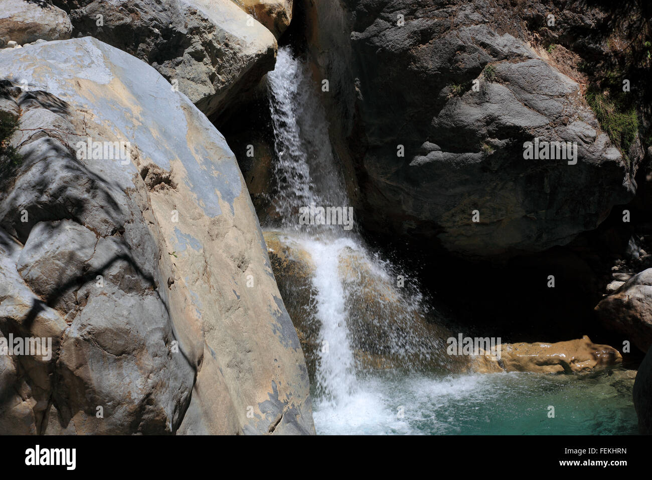 Crete, scenery in the Samaria gulch, water flows between the stones ...