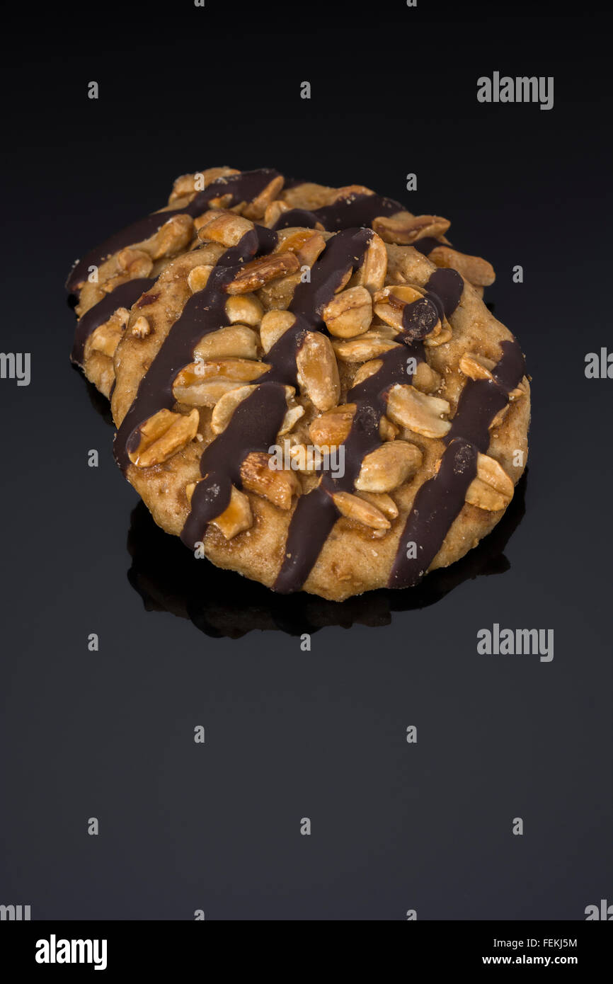 Biscuits / cookies on plain black, reflective, background - metaphor ...