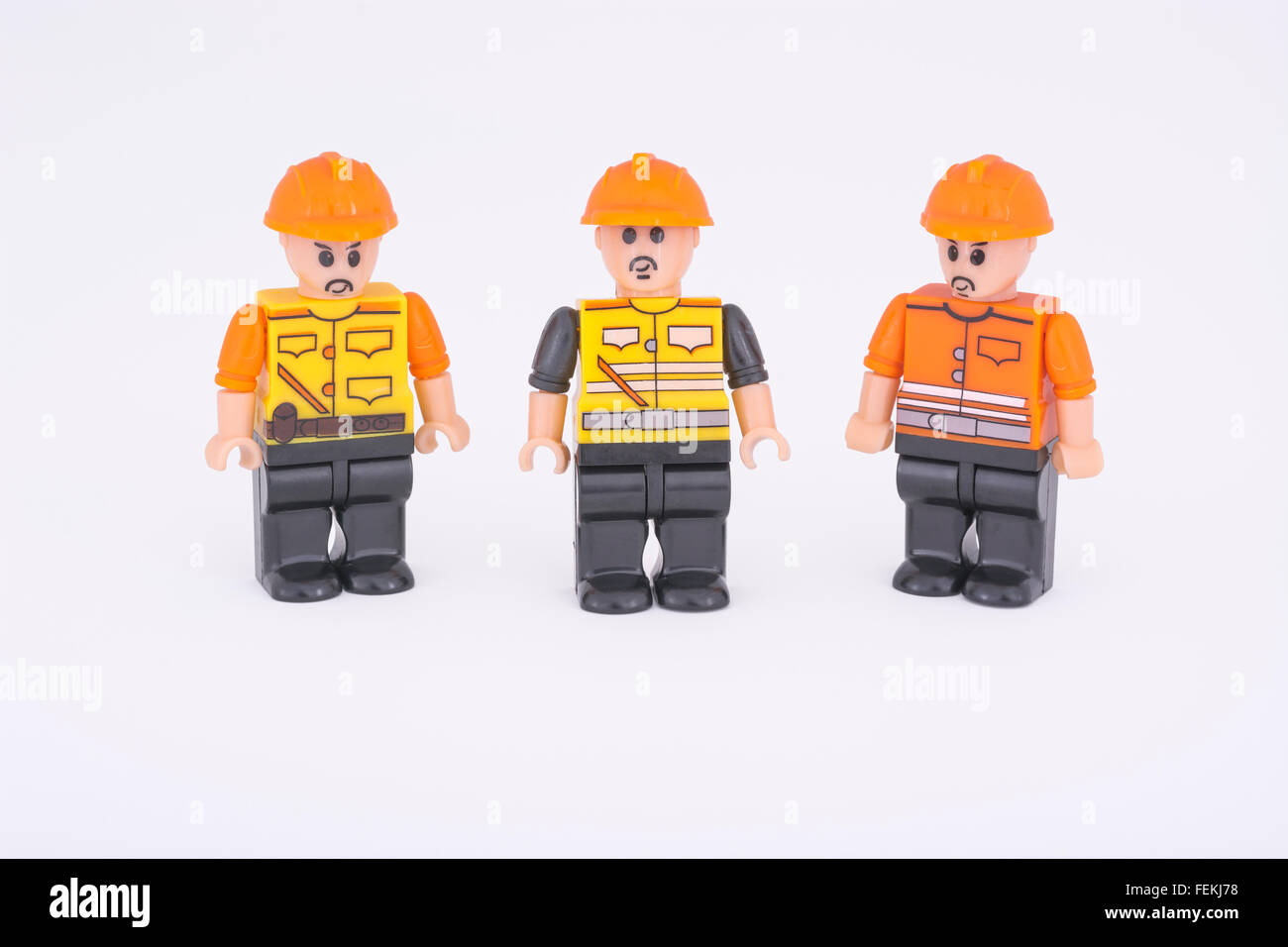 Three toy workmen - as visual metaphor for teamwork, crew, and working ...