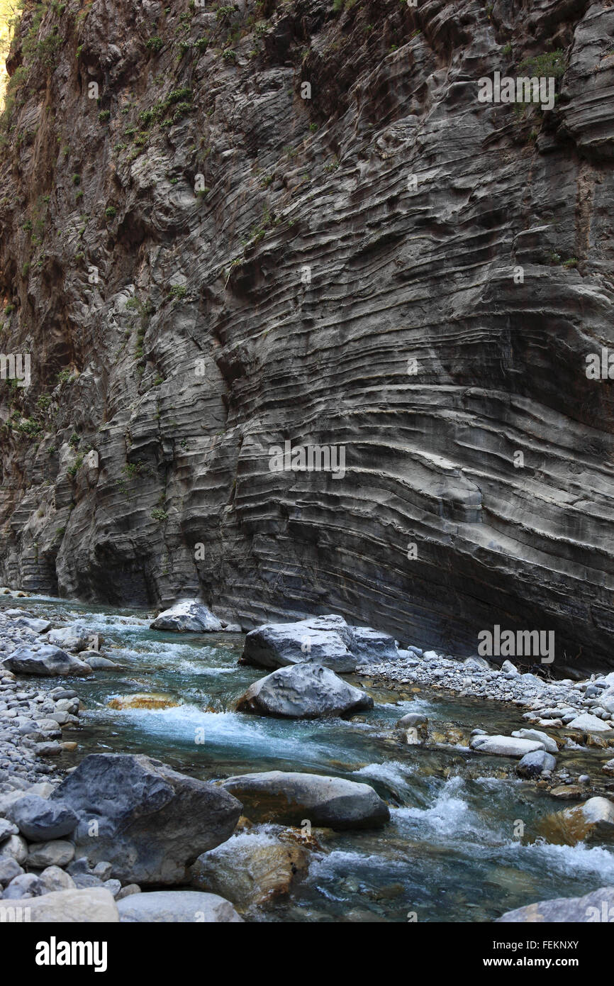 Crete, scenery in the Samaria gulch, fluent brook and high, gruff cliff ...