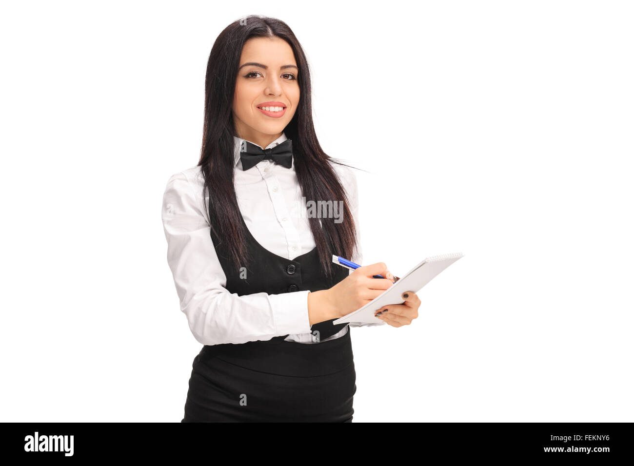 Studio shot of a young waitress writing on a notepad isolated on white ...