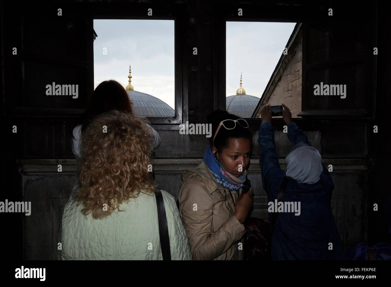 Tourist take pictures from a window in Hagia Sophia, Istanbul, Turkey ...