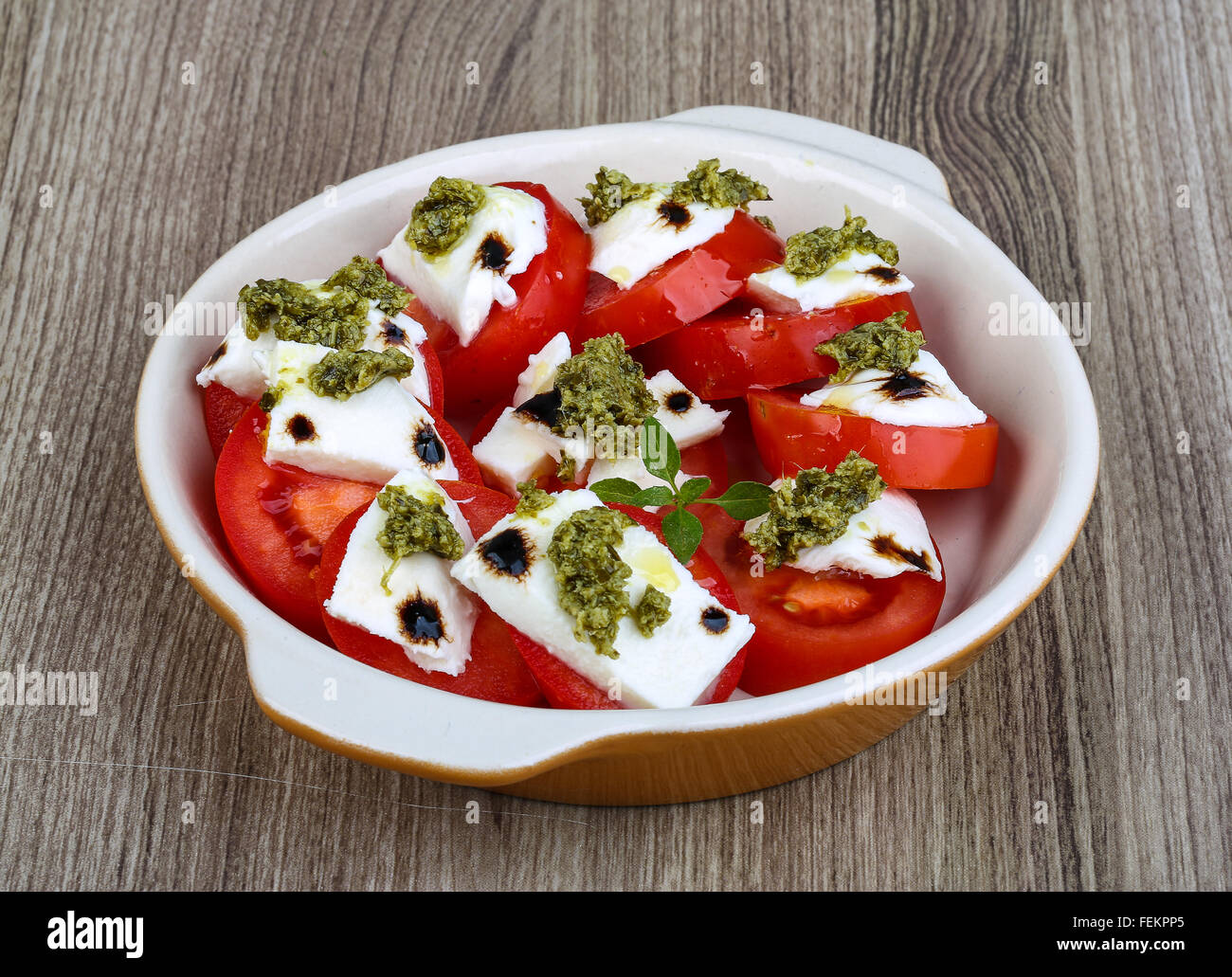 Traditional Italian Caprese salad on the wood background Stock Photo ...