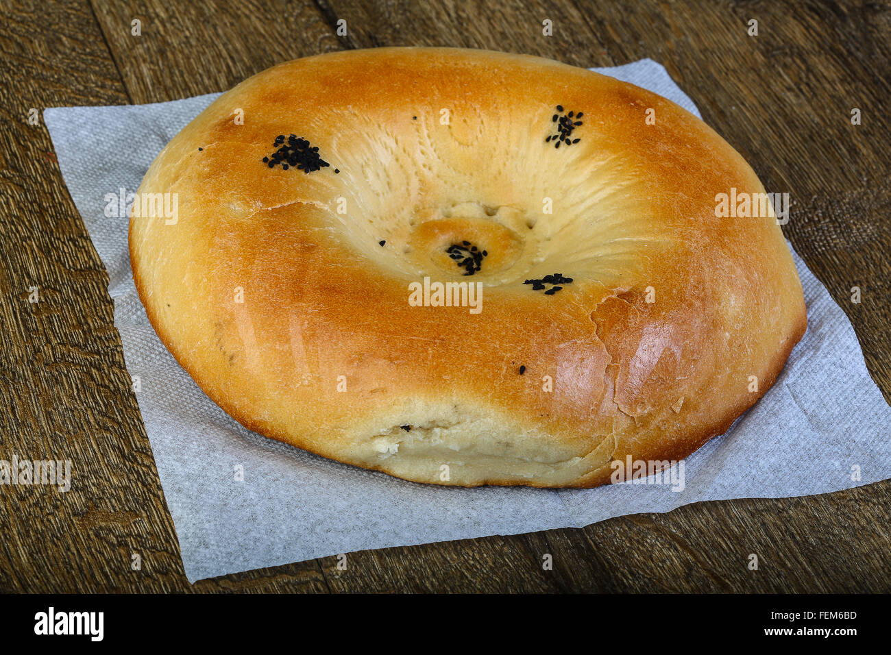 Traditional Uzbek bread on the wood background Stock Photo - Alamy