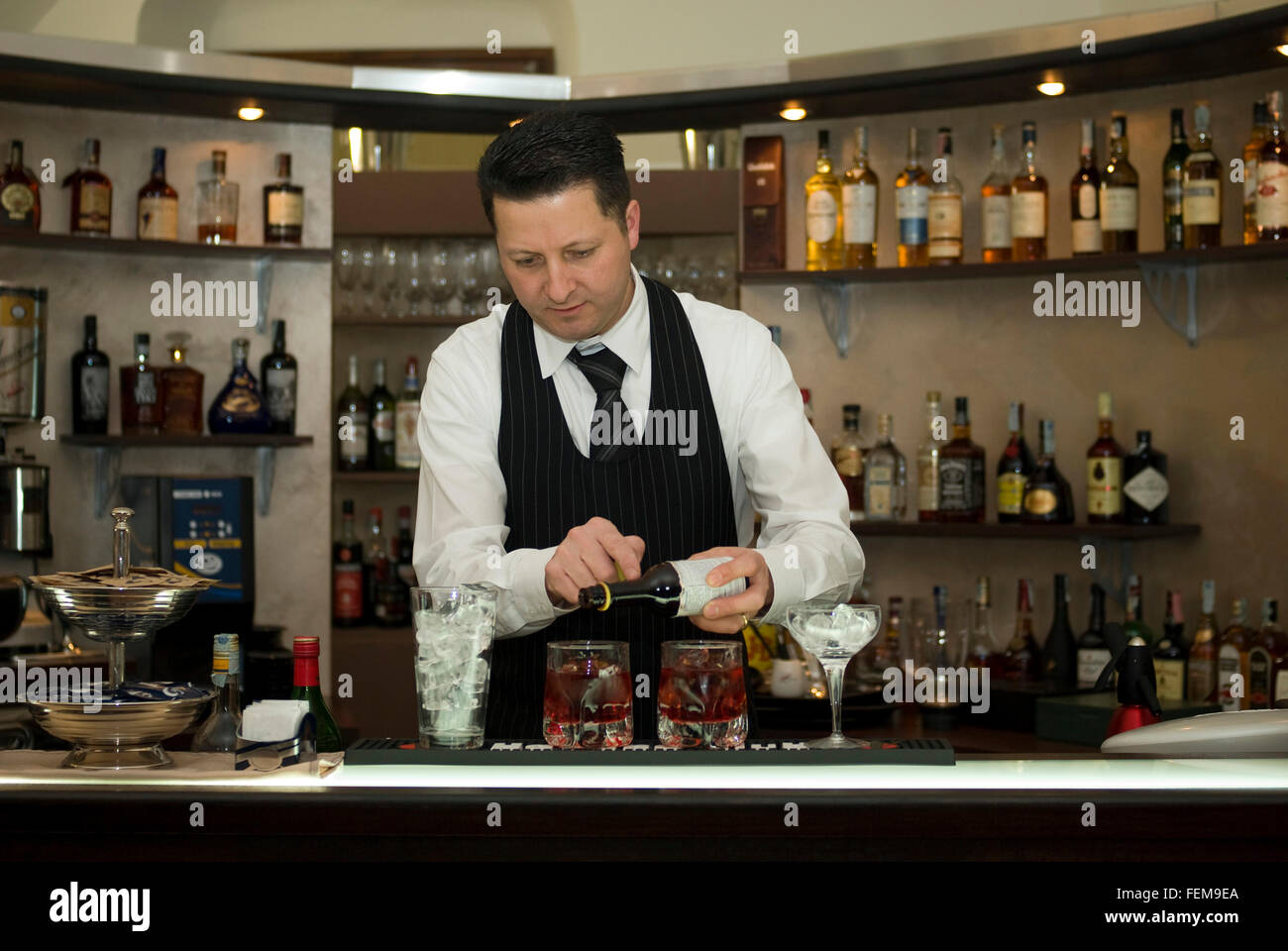 Barman at his bar Stock Photo - Alamy