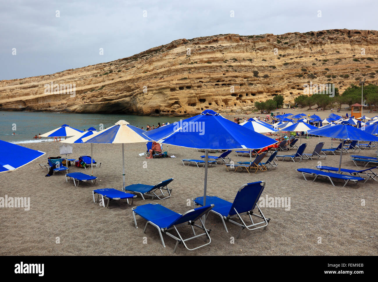 Crete, Matala, sandstone rock with caves in the bay of Messara, sun ...