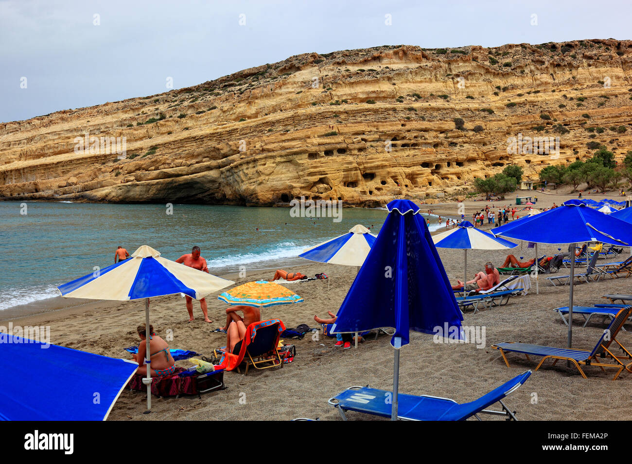 Crete, Matala, sandstone rock with caves in the bay of Messara, sun ...