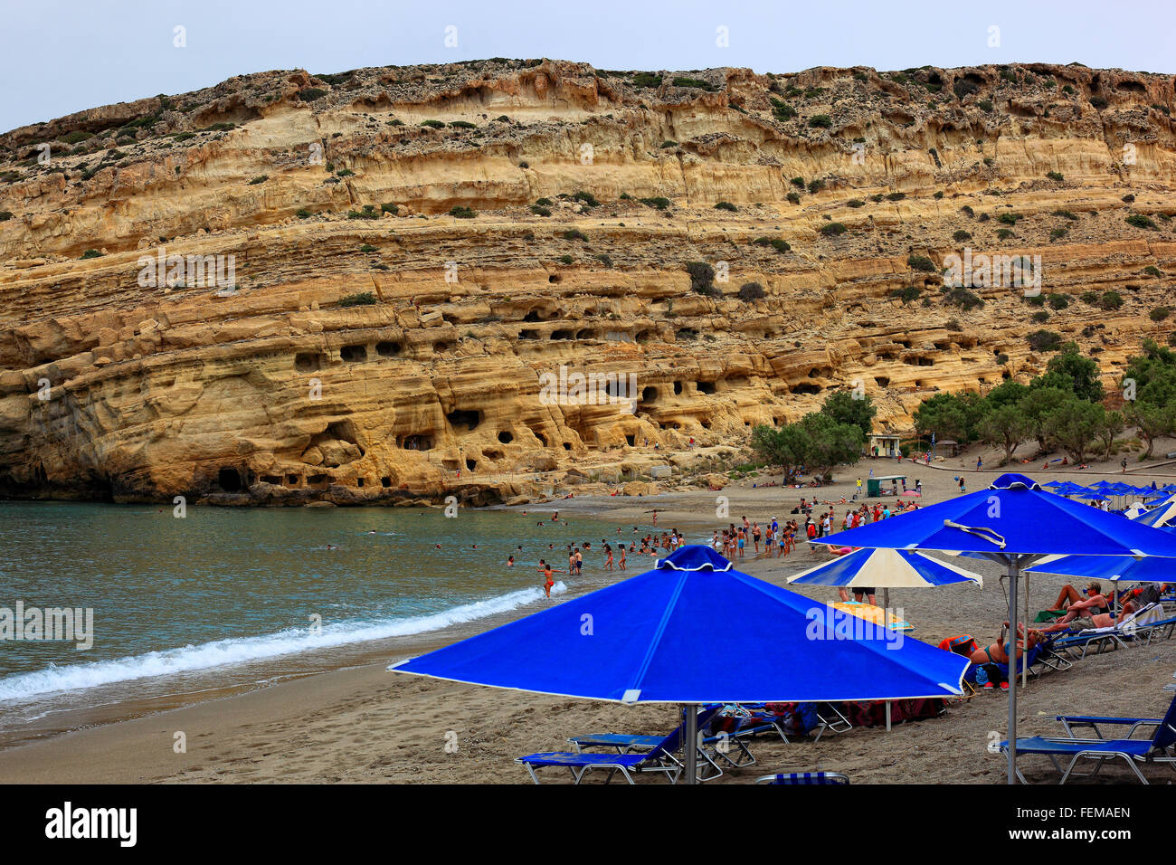 Crete, Matala, sandstone rock with caves in the bay of Messara, sun ...