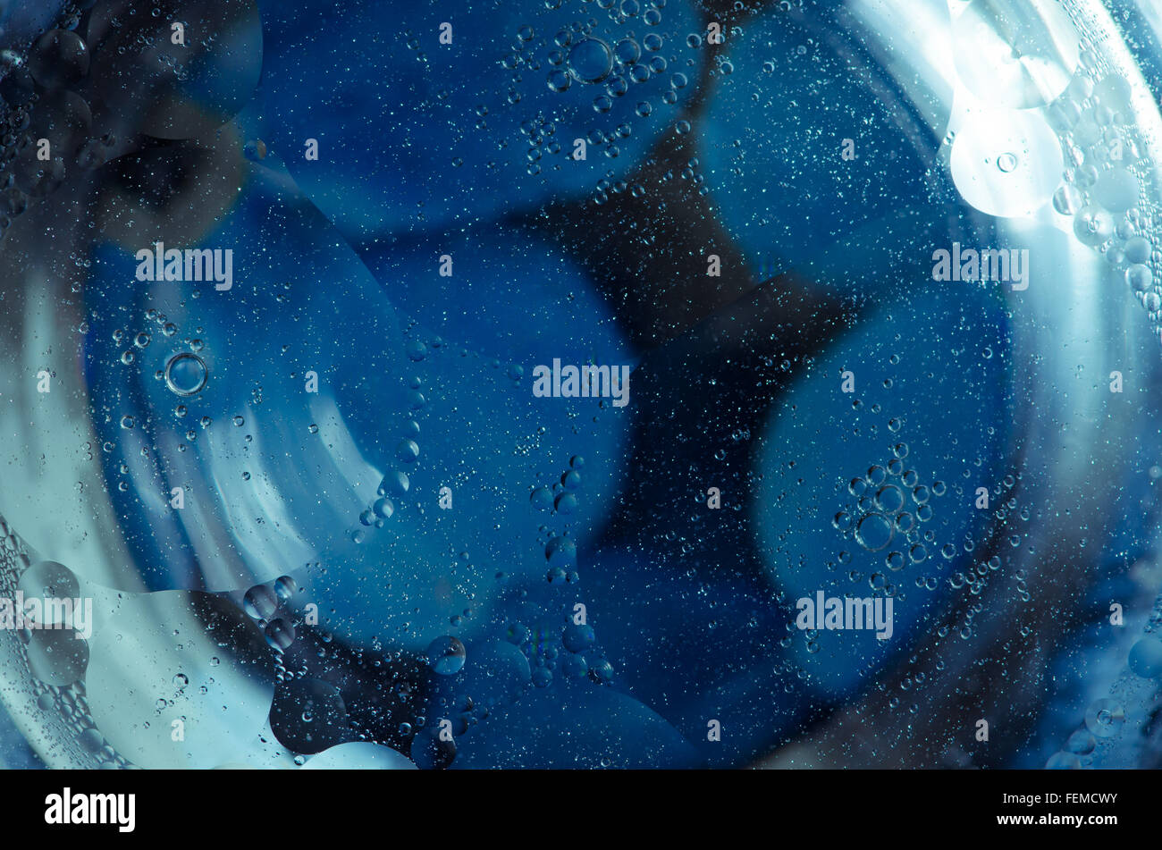 blue bubbles from oil over water surface Stock Photo - Alamy