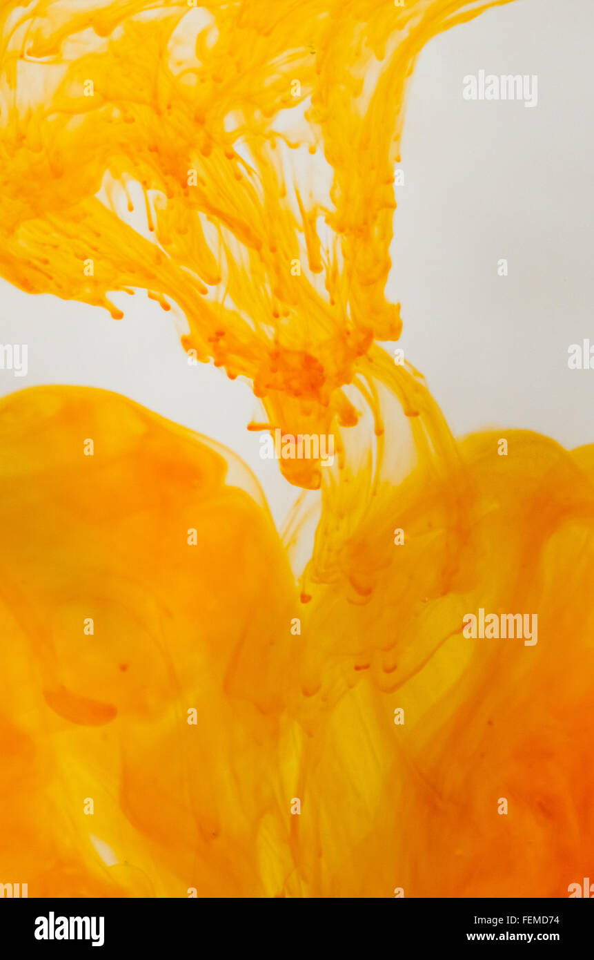 abstract orange color paint splash into water Stock Photo - Alamy