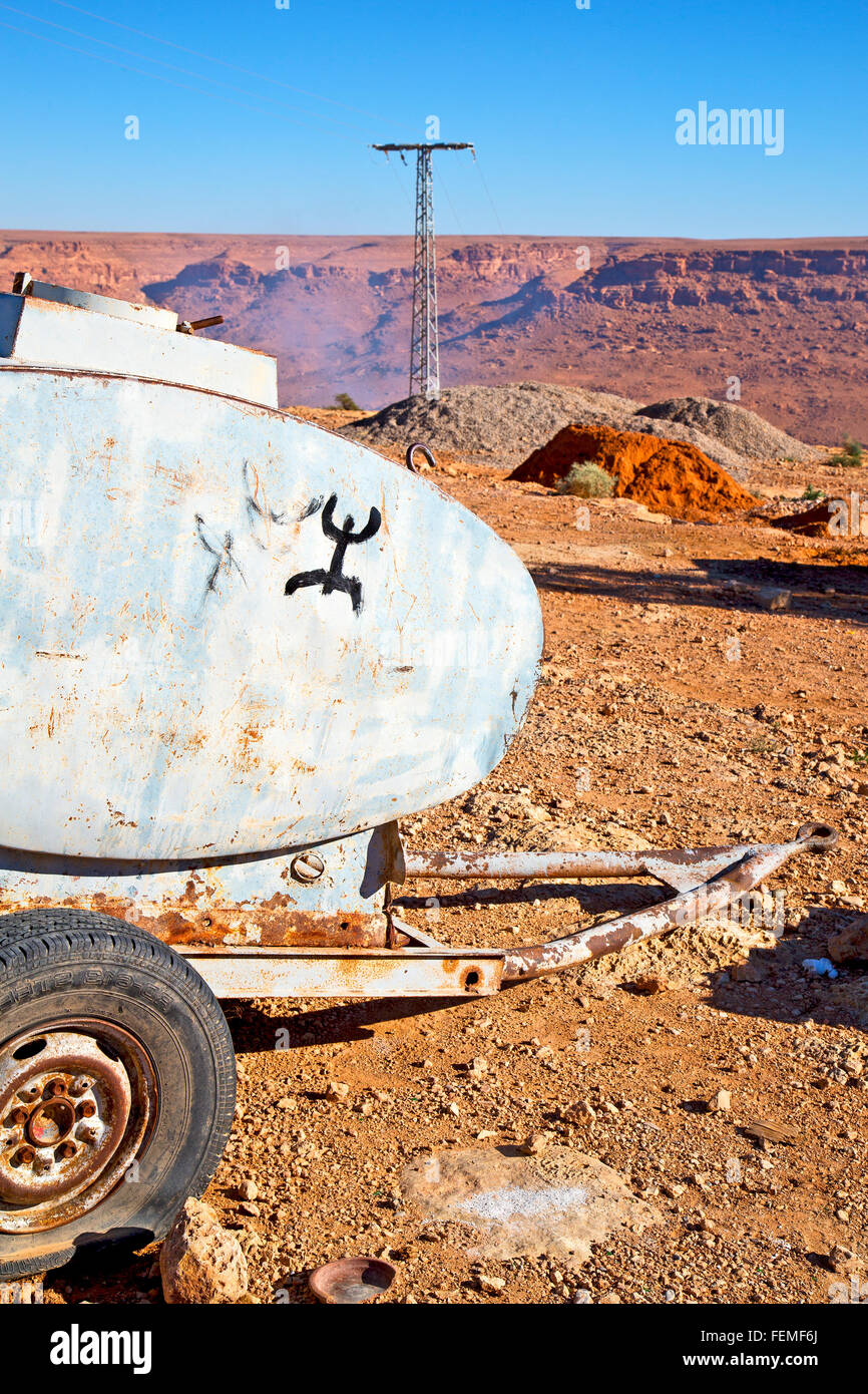 water tank in morocco africa land gray metal weel and arid Stock Photo ...