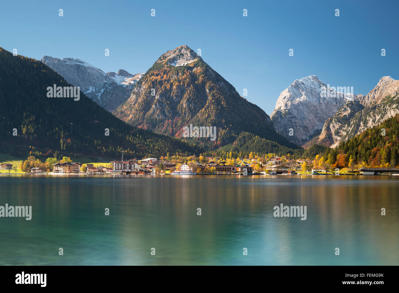Pertisau at lake Achensee before the autumnal coloured forests and ...