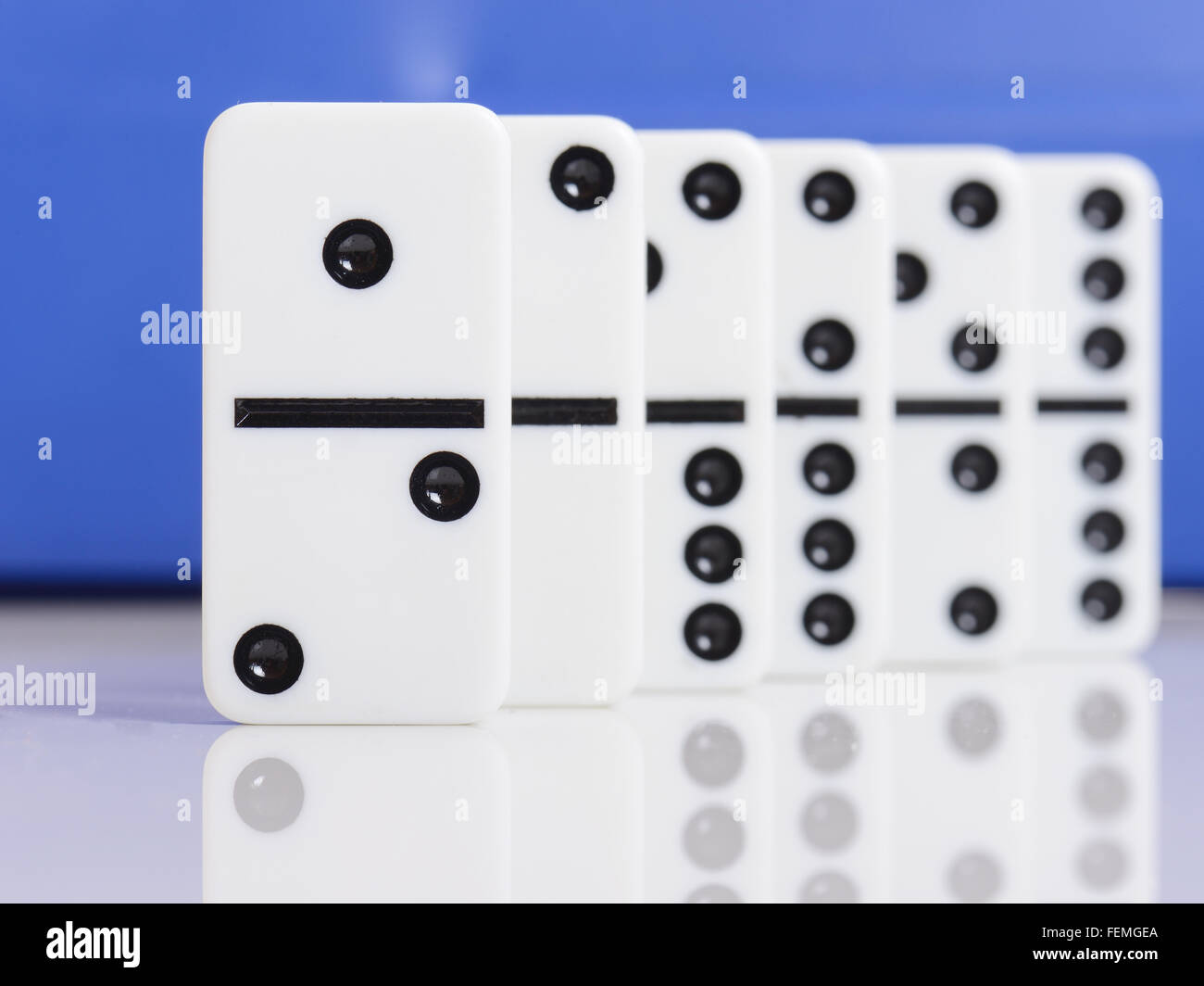 line of dominos with number one at the front Stock Photo - Alamy