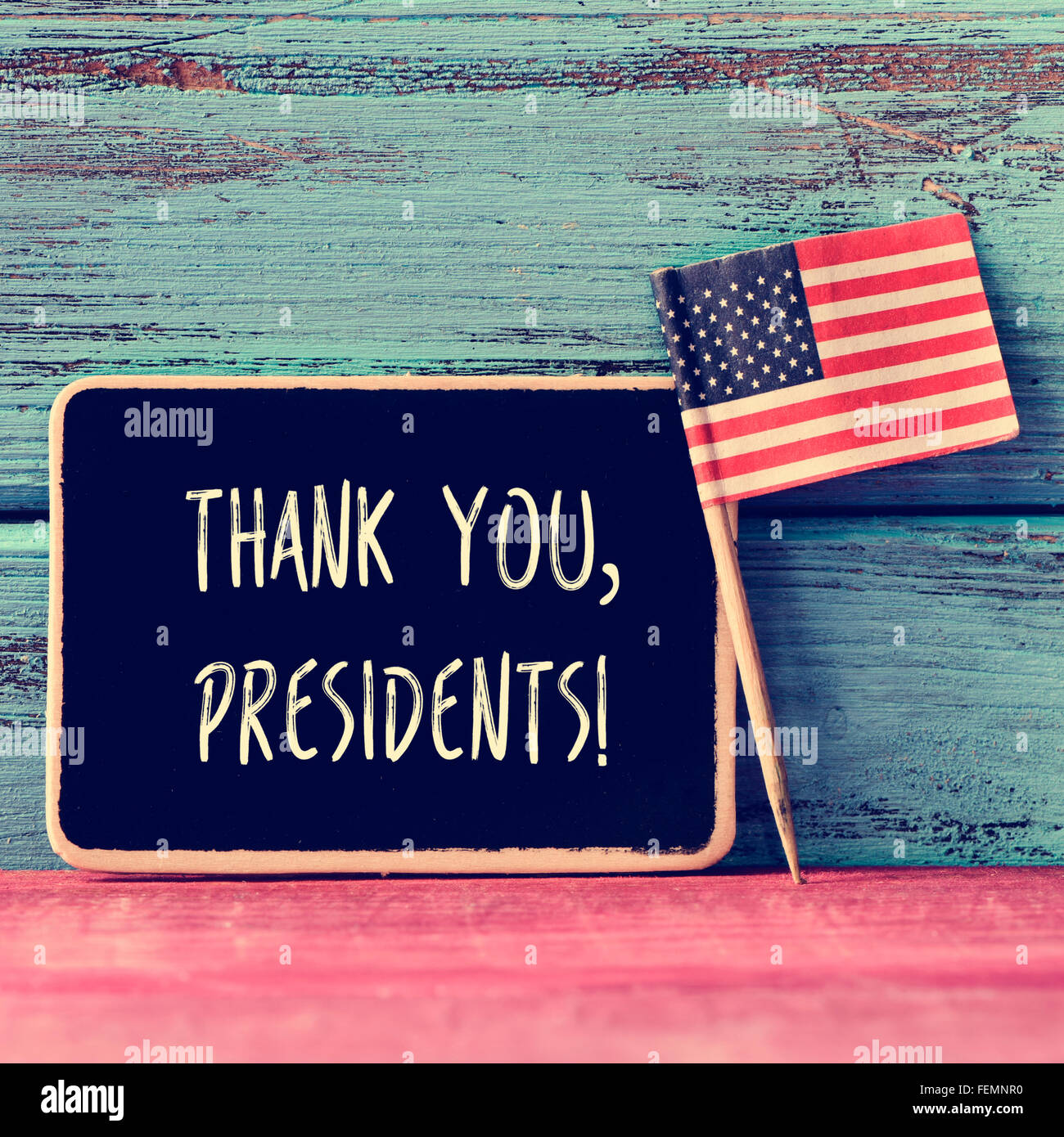 the text thank you presidents written in a chalkboard and a flag of the ...