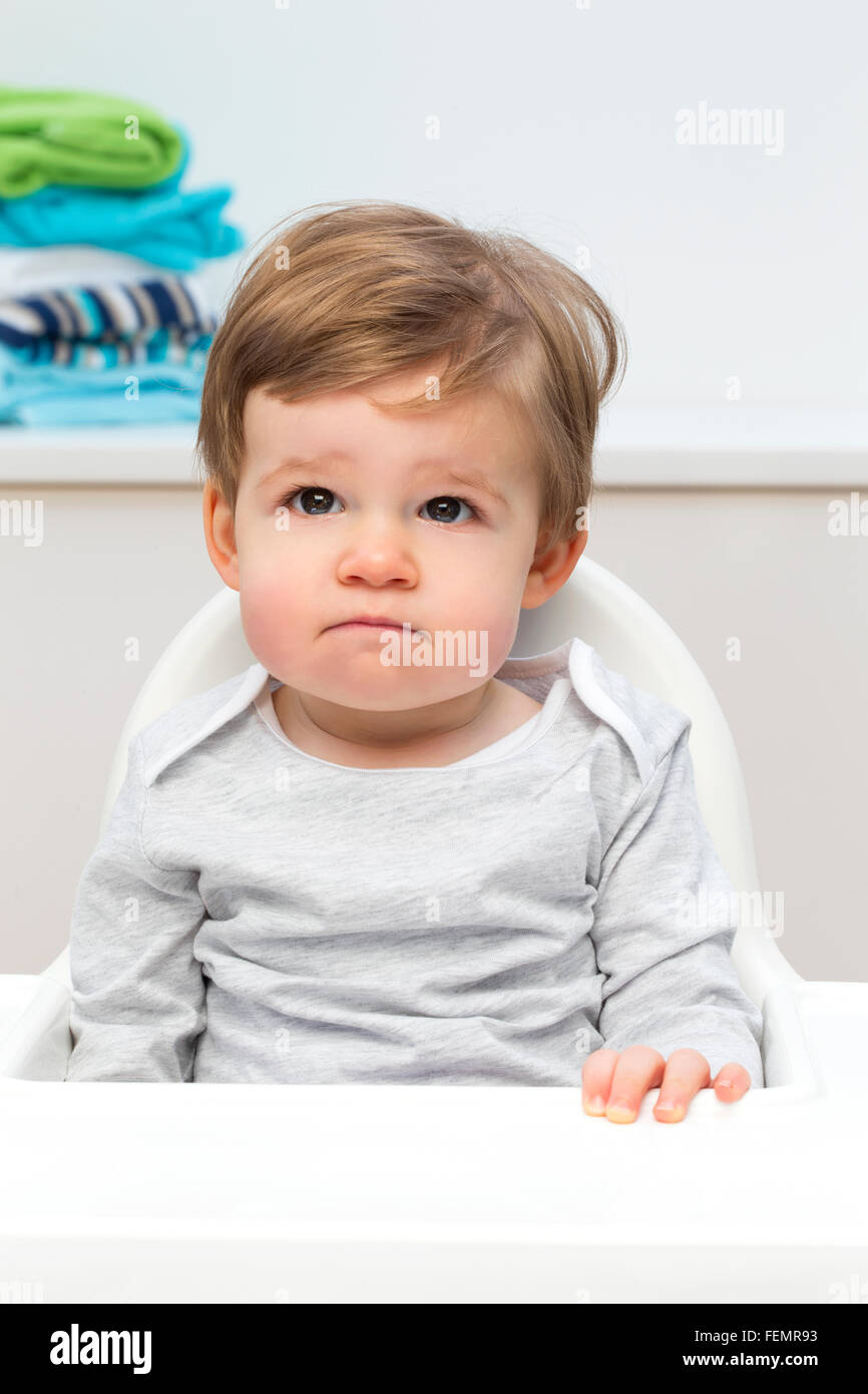 Baby high chair unhappy hi-res stock photography and images - Alamy