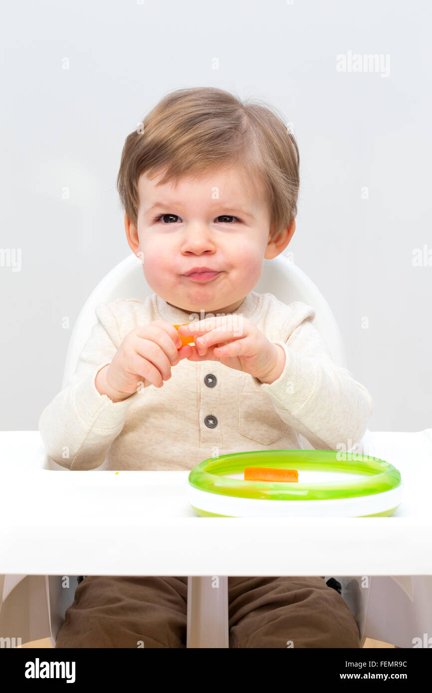Boy eating carrot sticks hi-res stock photography and images - Alamy