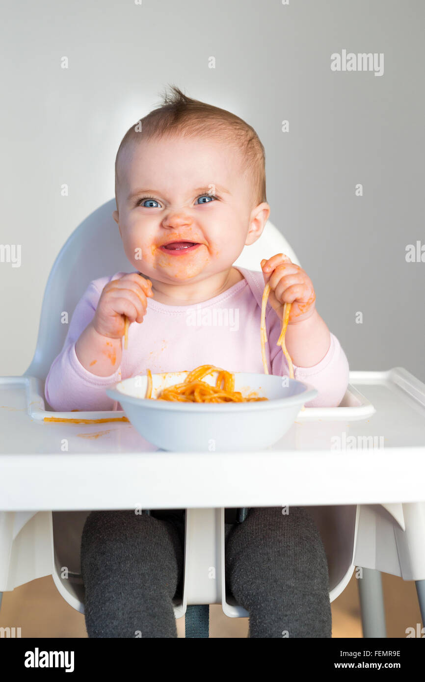 Little Girl Eating her dinner and making a mess Stock Photo - Alamy