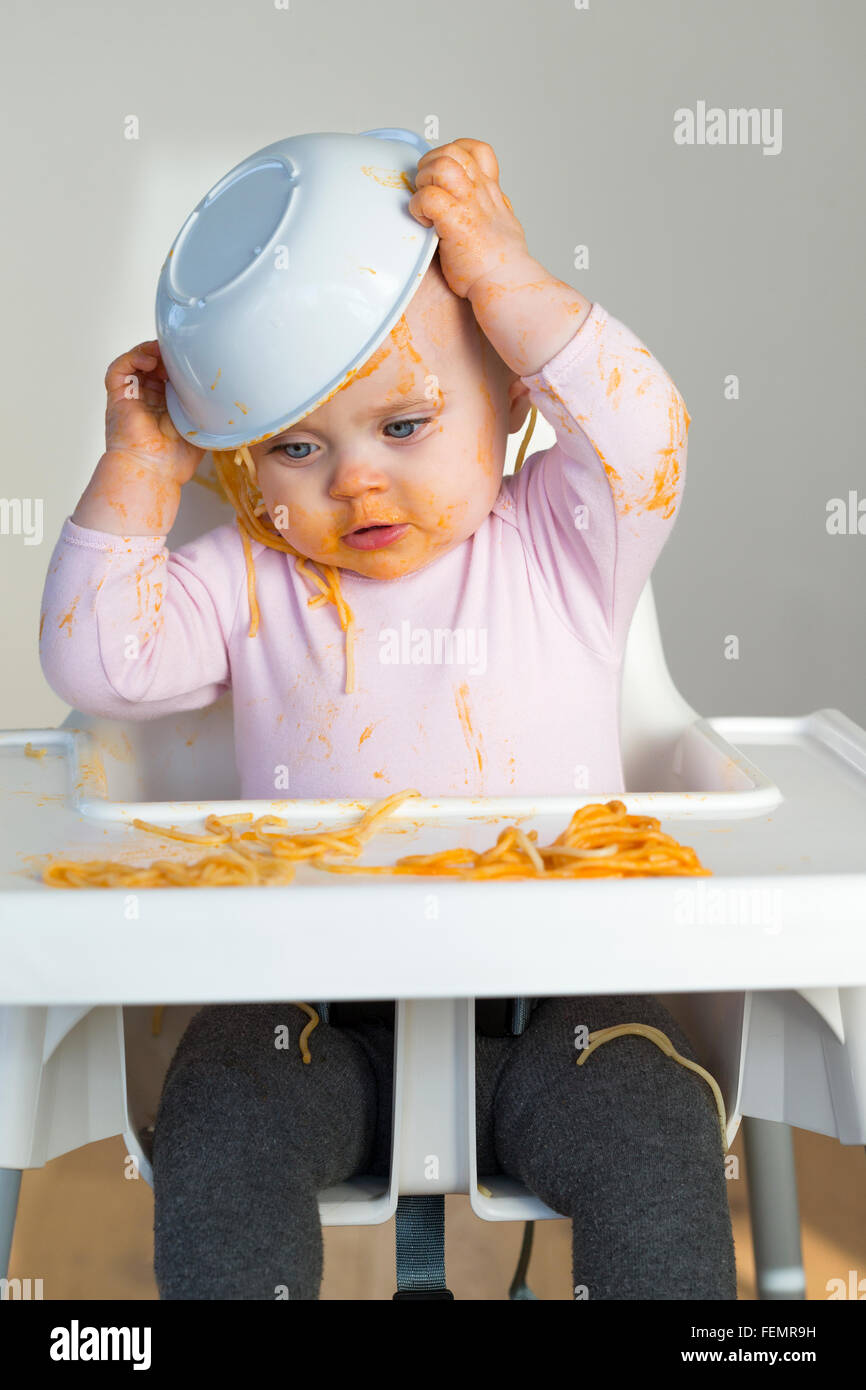 Little Girl Eating her dinner and making a mess Stock Photo - Alamy