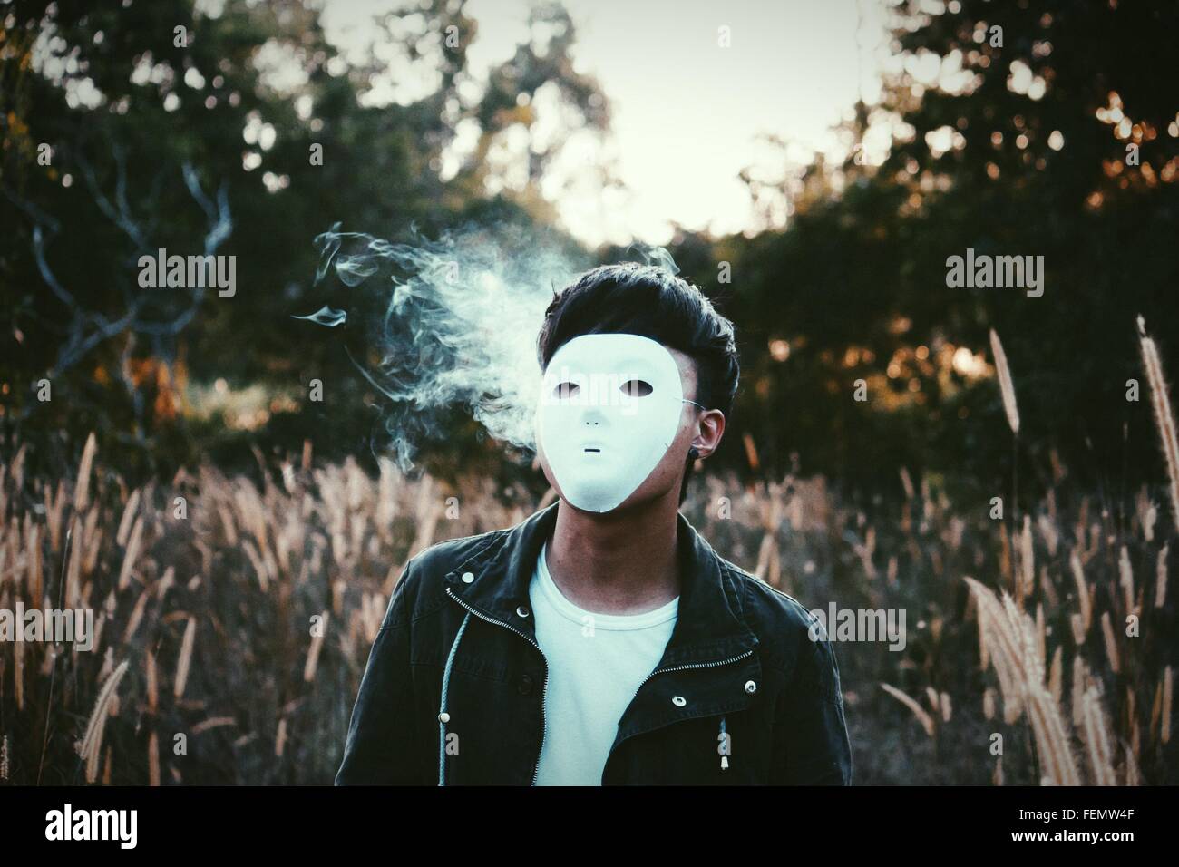 Person behind the mask hi-res stock photography and images - Alamy