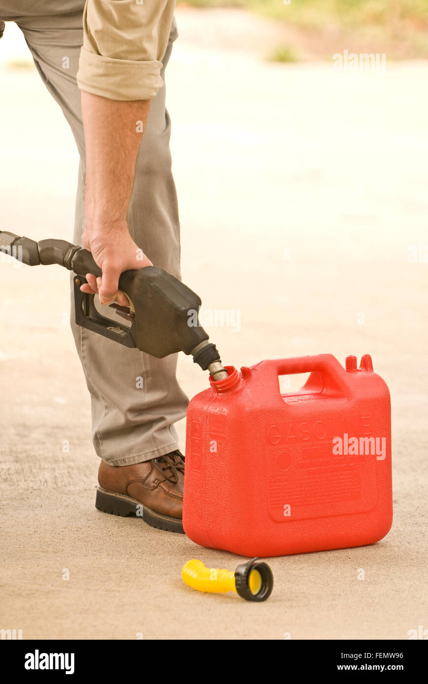 Hand Filling Gas Can Stock Photo - Alamy