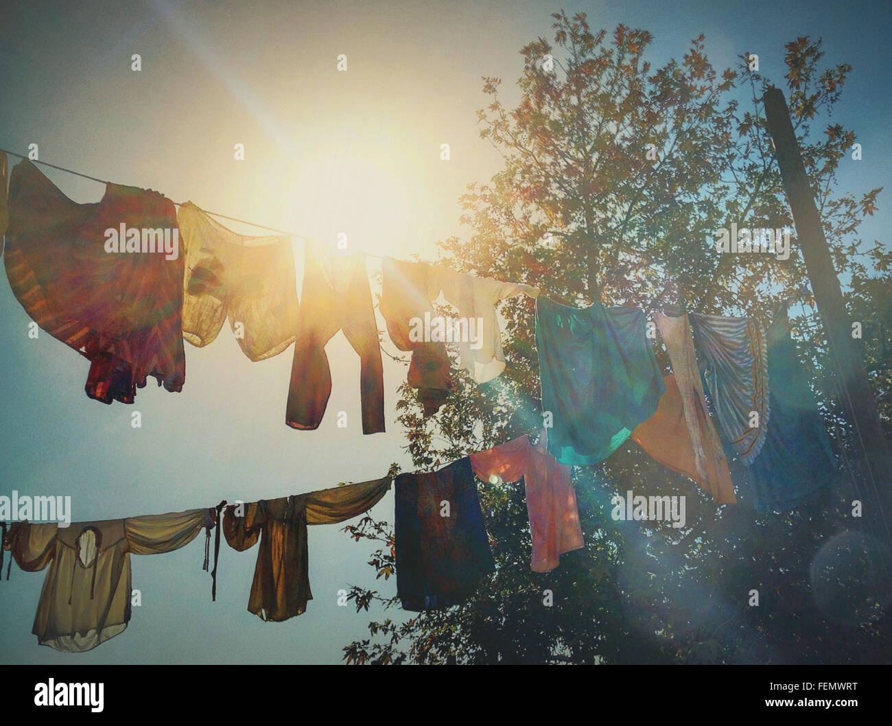 Laundry Hanging In Sunlight Stock Photo - Alamy