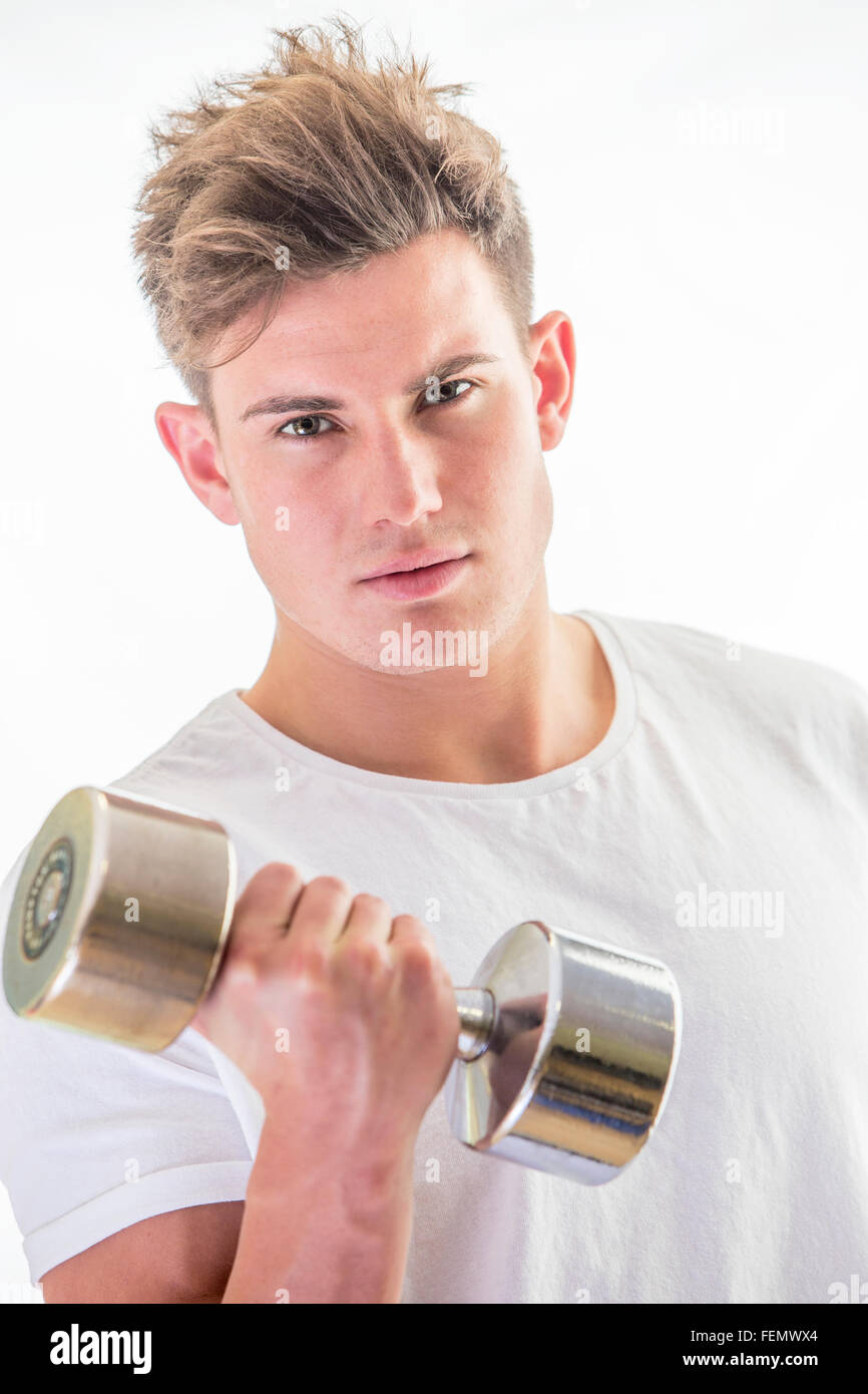 Attractive young man posing with gym weights Stock Photo - Alamy