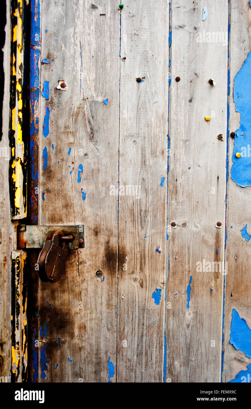 Yellow and Blue distressed paint on wooden door Stock Photo - Alamy