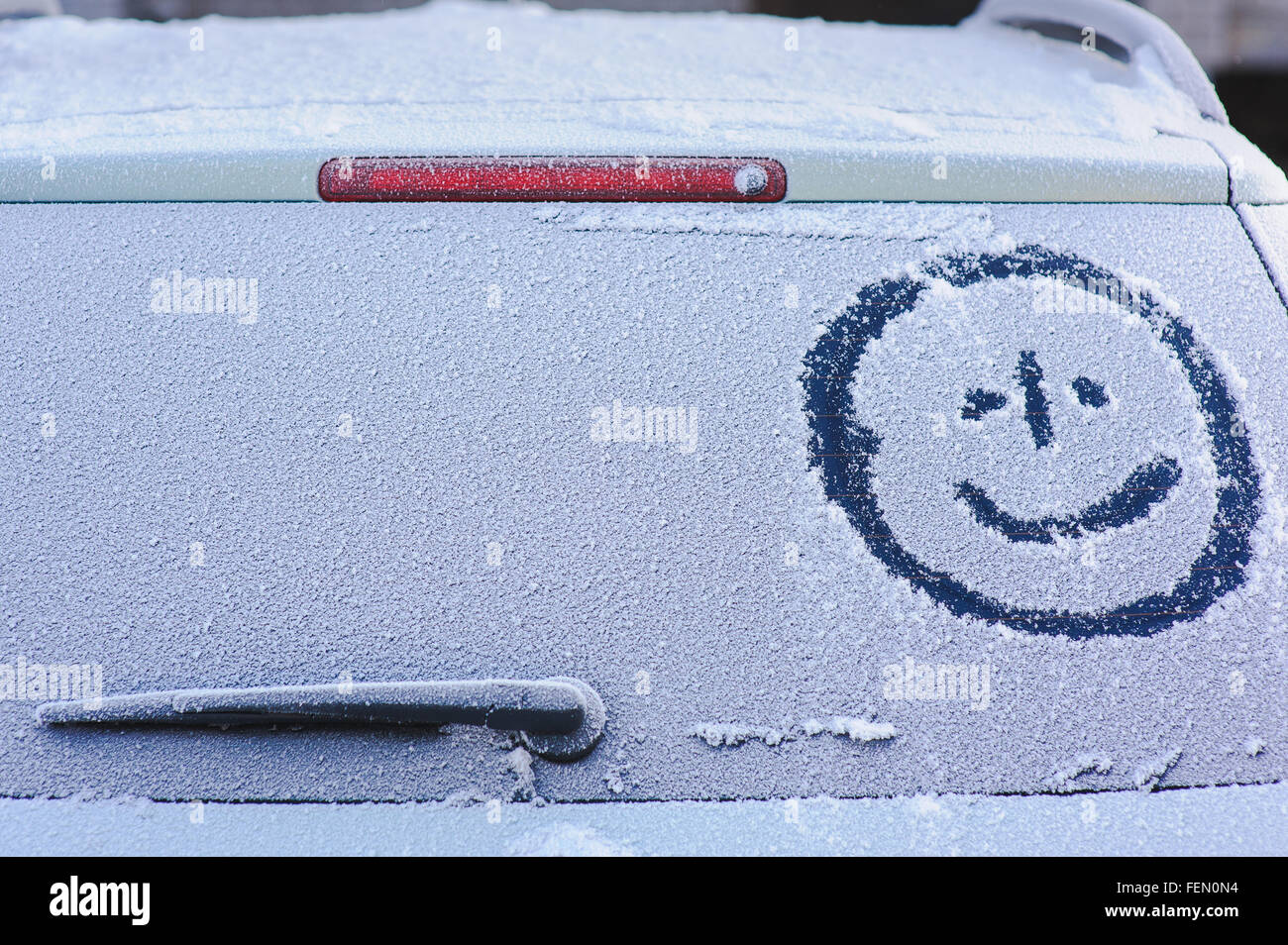 Drawing on the rear window of a car made by hand Stock Photo - Alamy