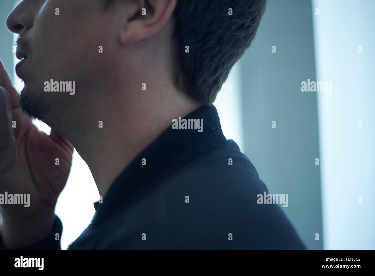 Man touching chin hi-res stock photography and images - Alamy